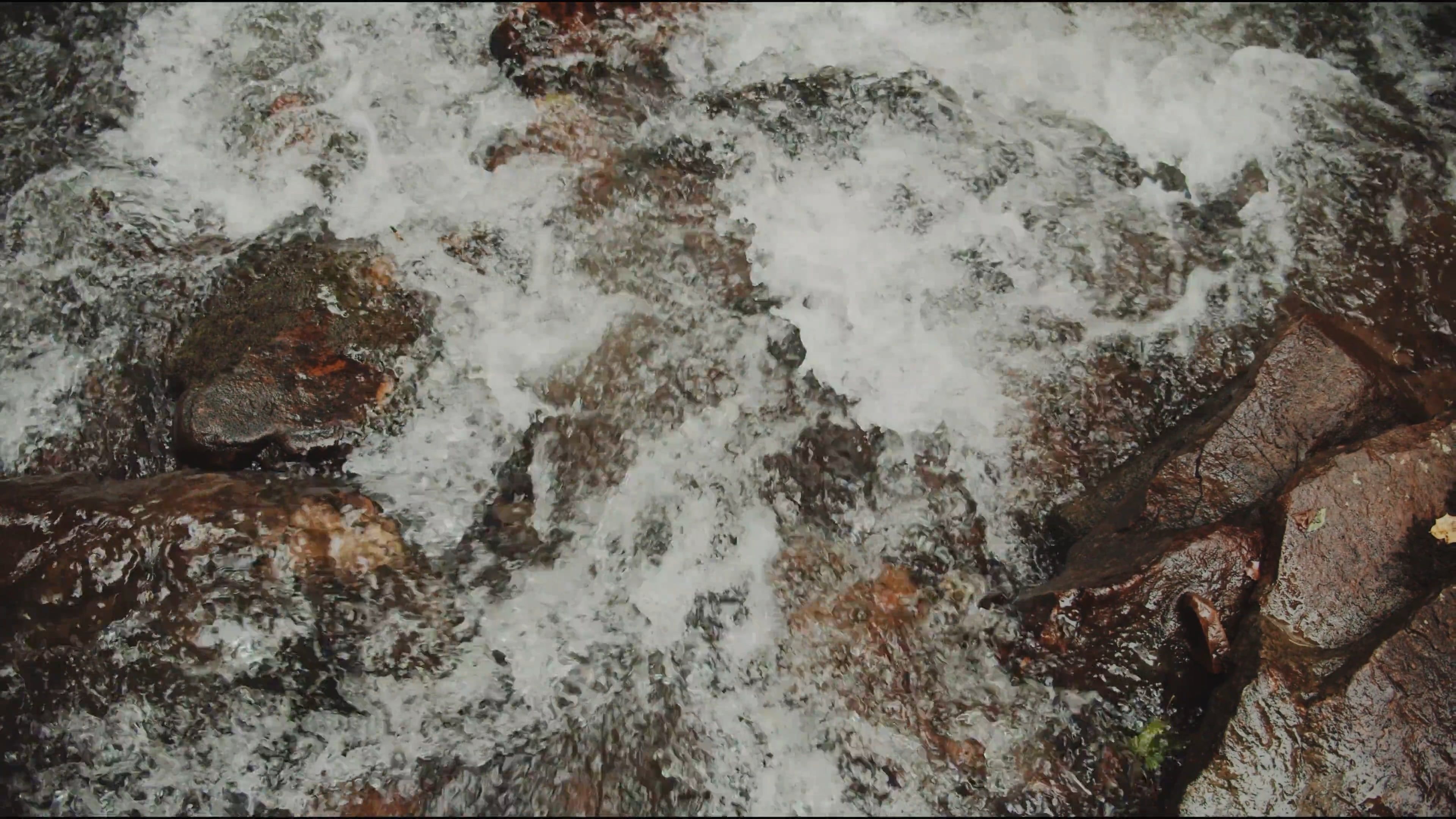 Flowing Water Crashing into Rocks · Free Stock Video