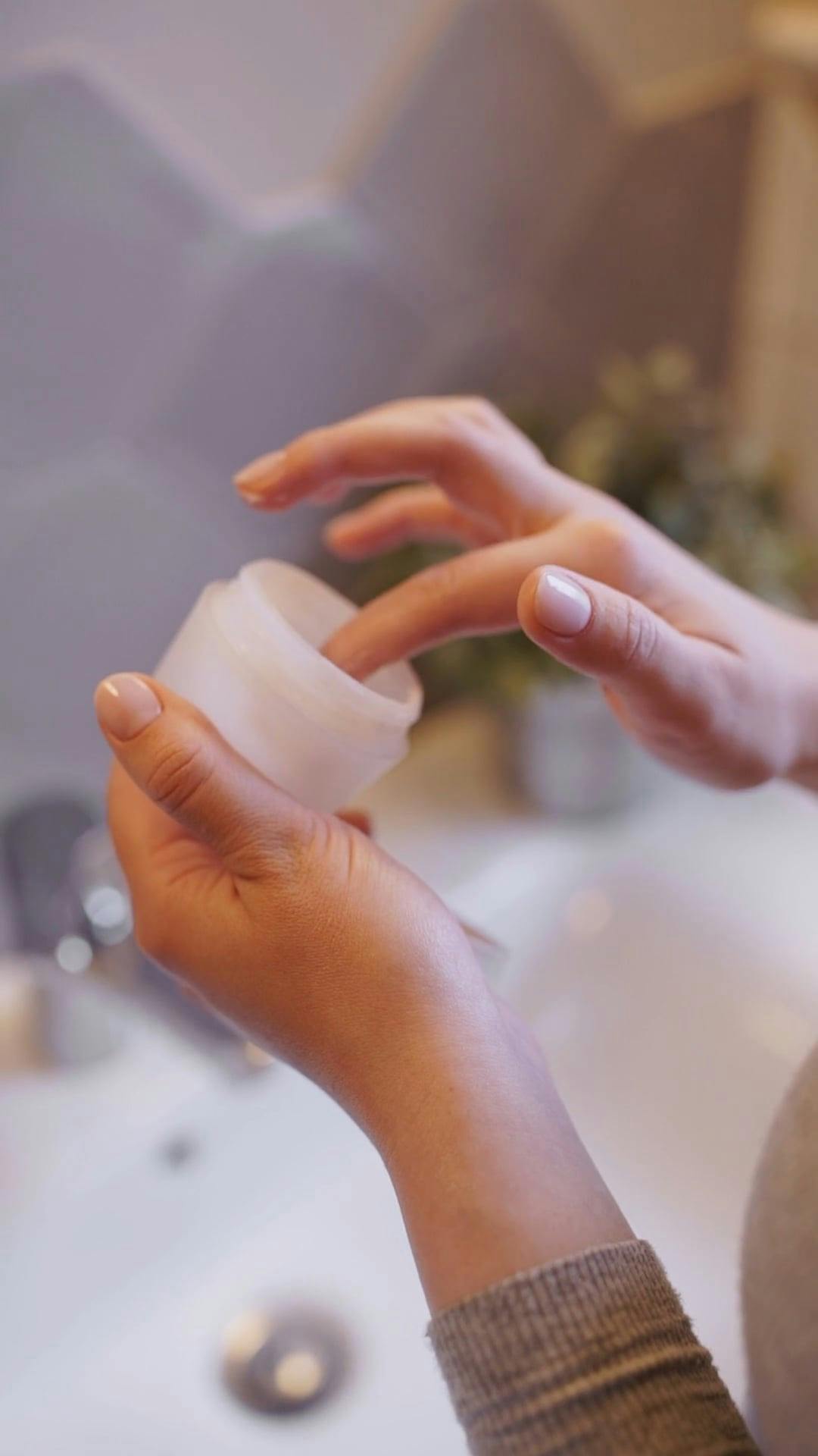 A Person Putting Cream on the Hand · Free Stock Video