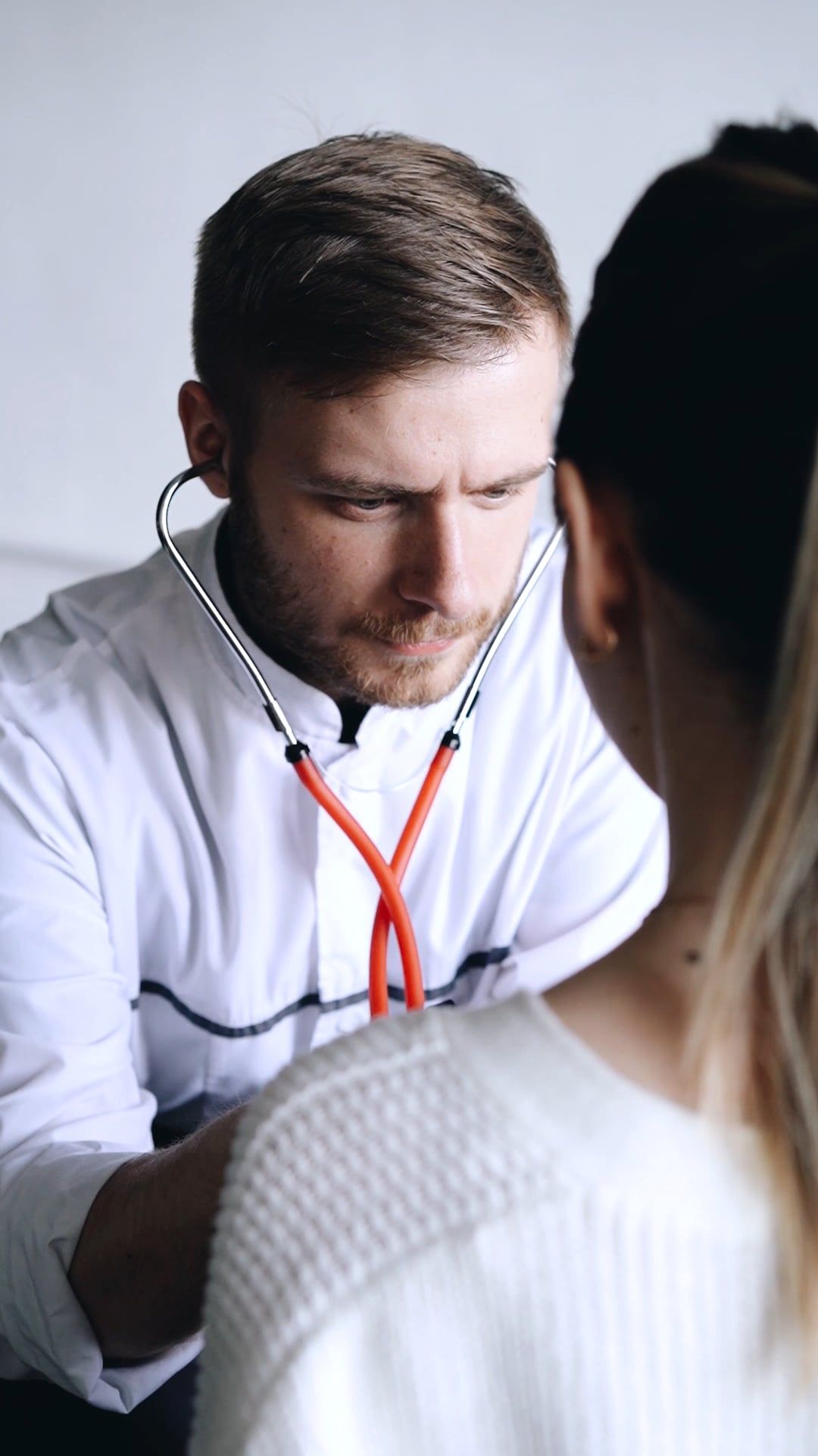 A Doctor Checking on his Patient's Breathing · Free Stock Video