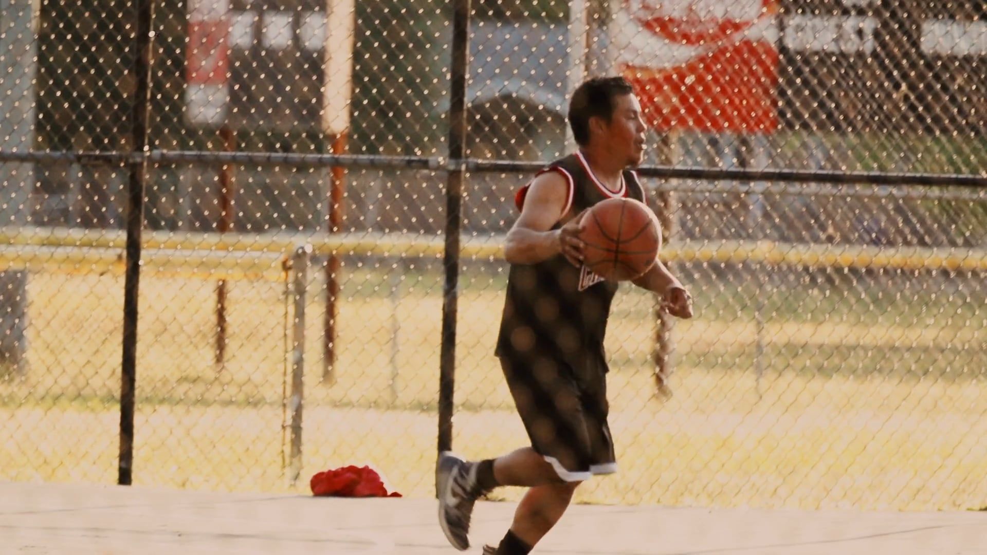 A Man Dribbling a Ball on the Court · Free Stock Video