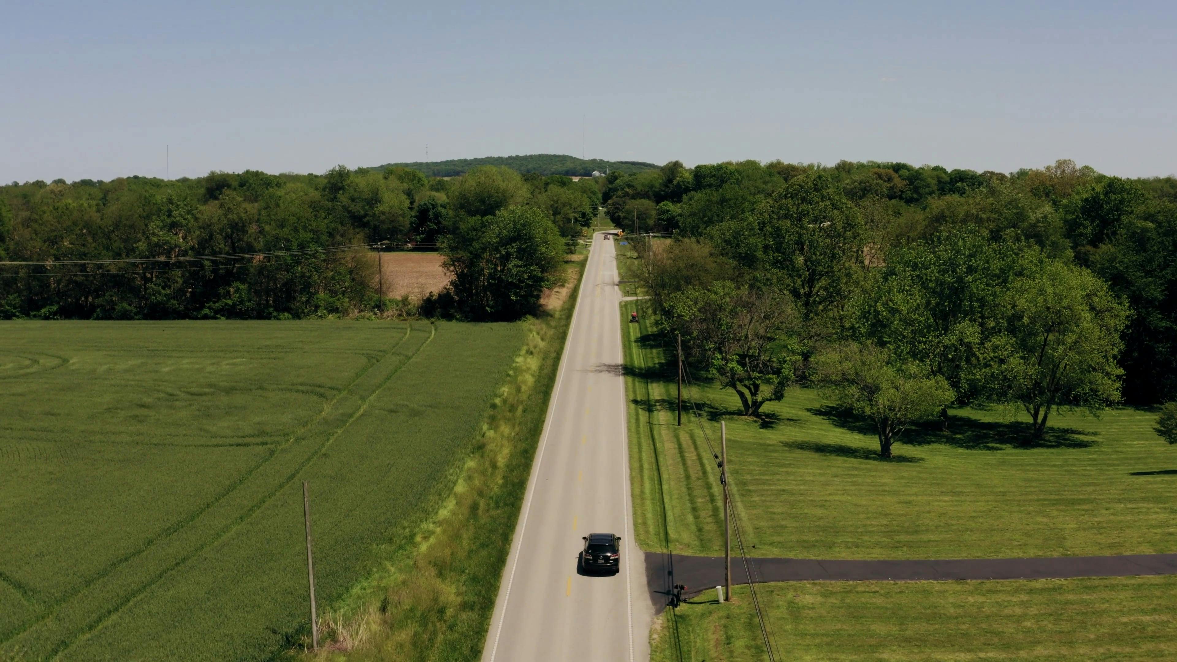 Drone Shot of the Highway in the Middle of the Grass Field · Free Stock ...