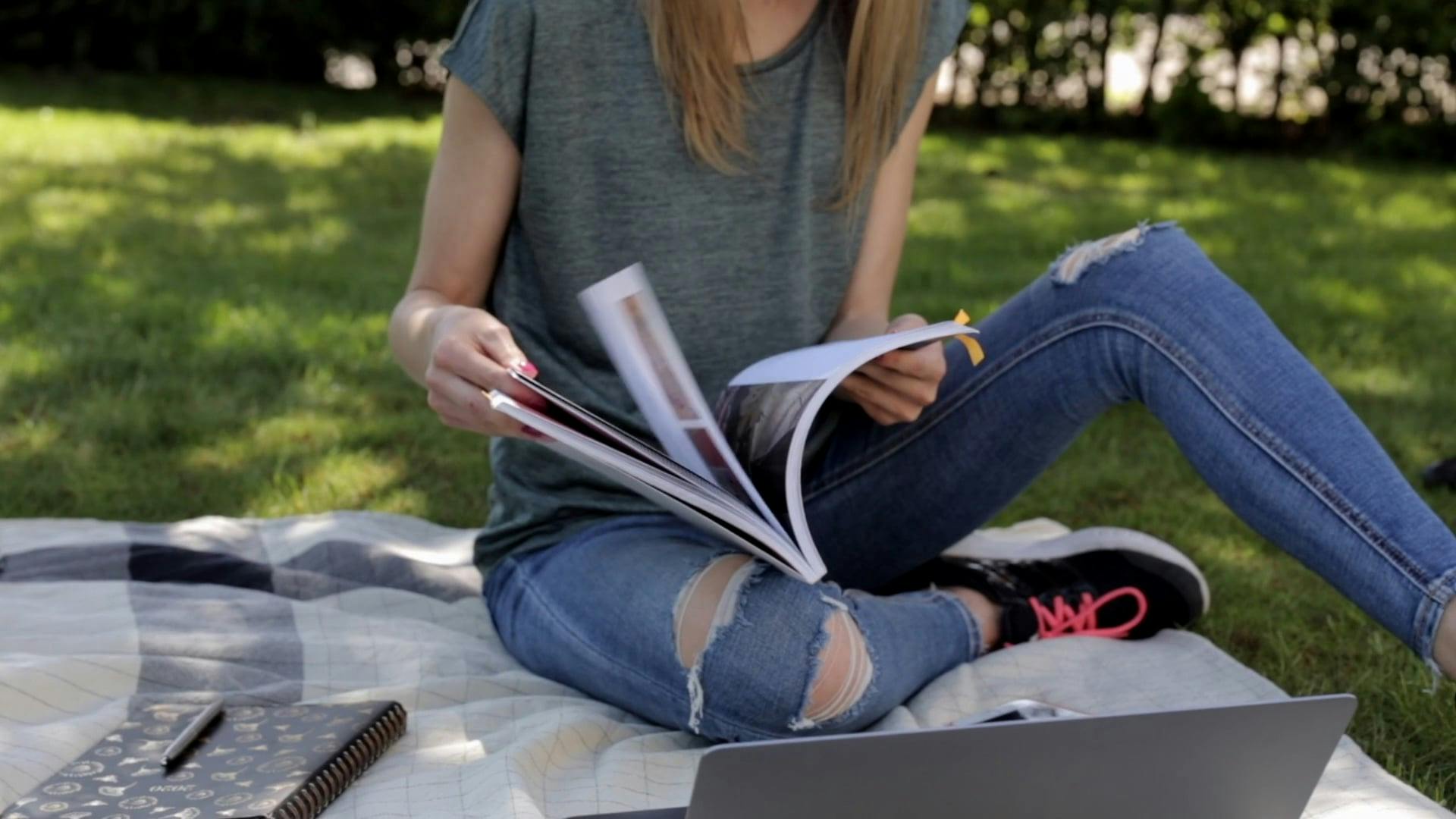 Woman Flipping Pages of the Magazine · Free Stock Video