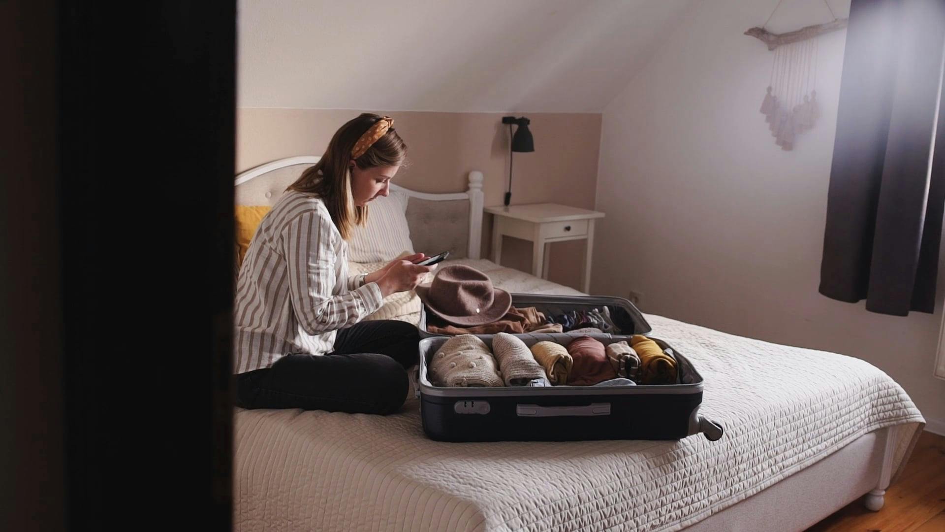 A Push In Shot of a Woman Packing Her Bag Free Stock Video Footage ...