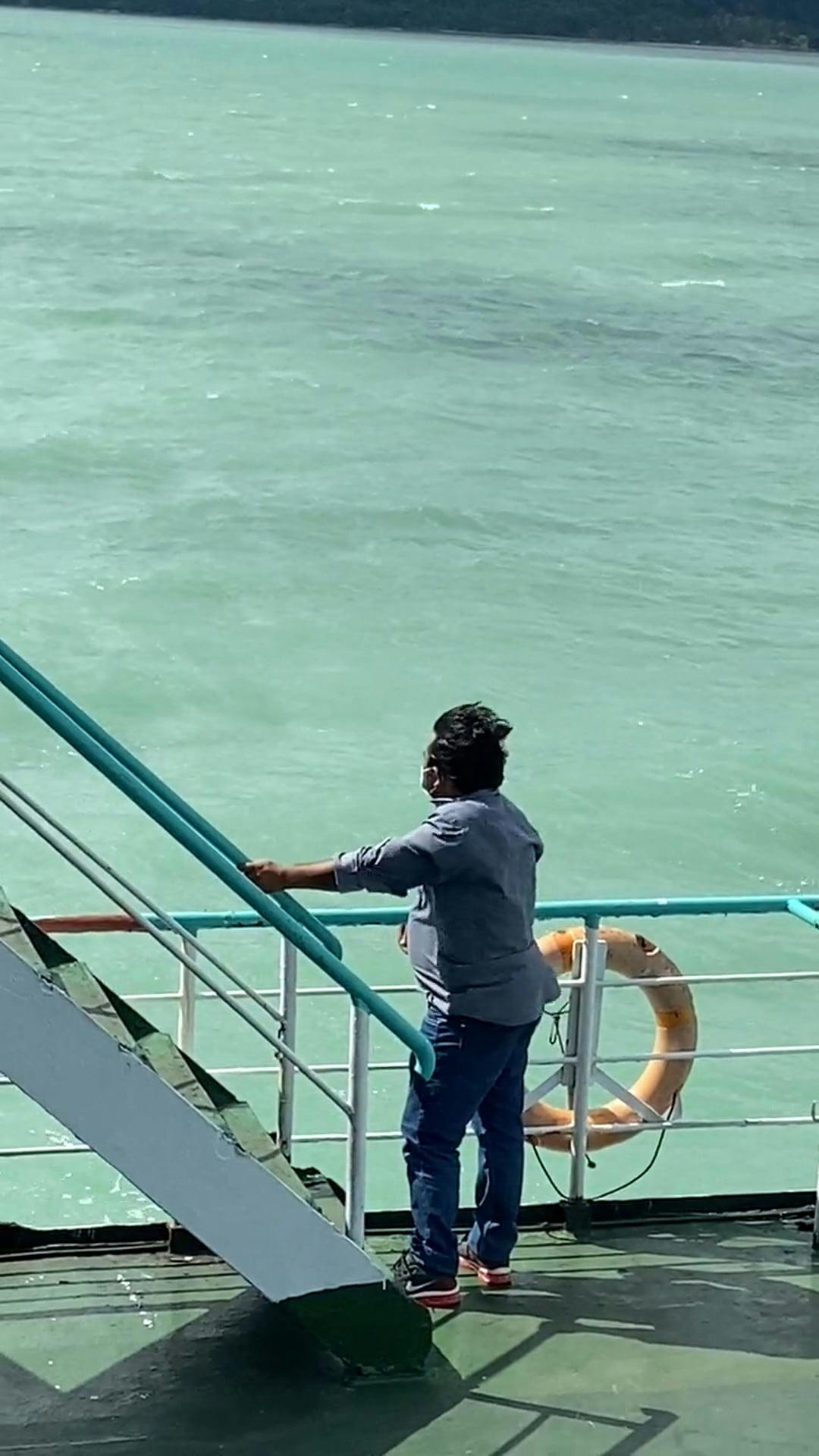 Man Standing on Ferry Boat Looking at the Ocean Free Stock Video ...
