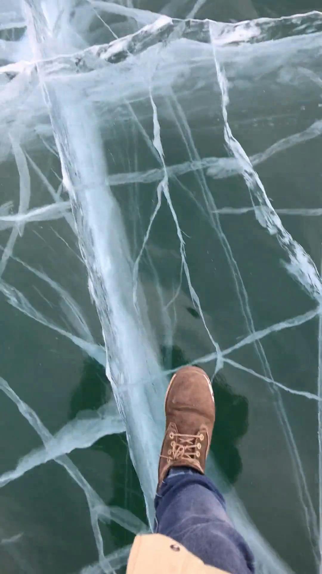 A Person Walking on Ice · Free Stock Video
