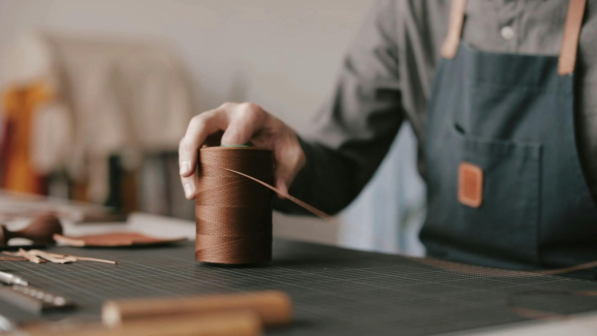 A Person Pulling Thread on a Work Table Free Stock Video Footage ...