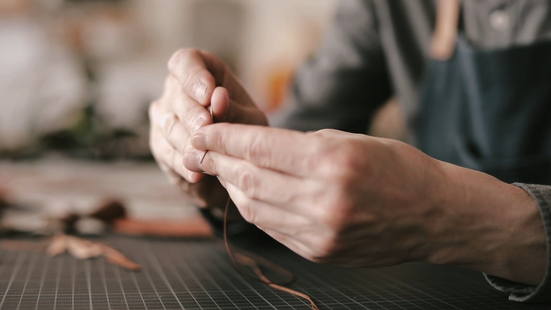 Man Putting a Brown Thread in the Needle · Free Stock Video