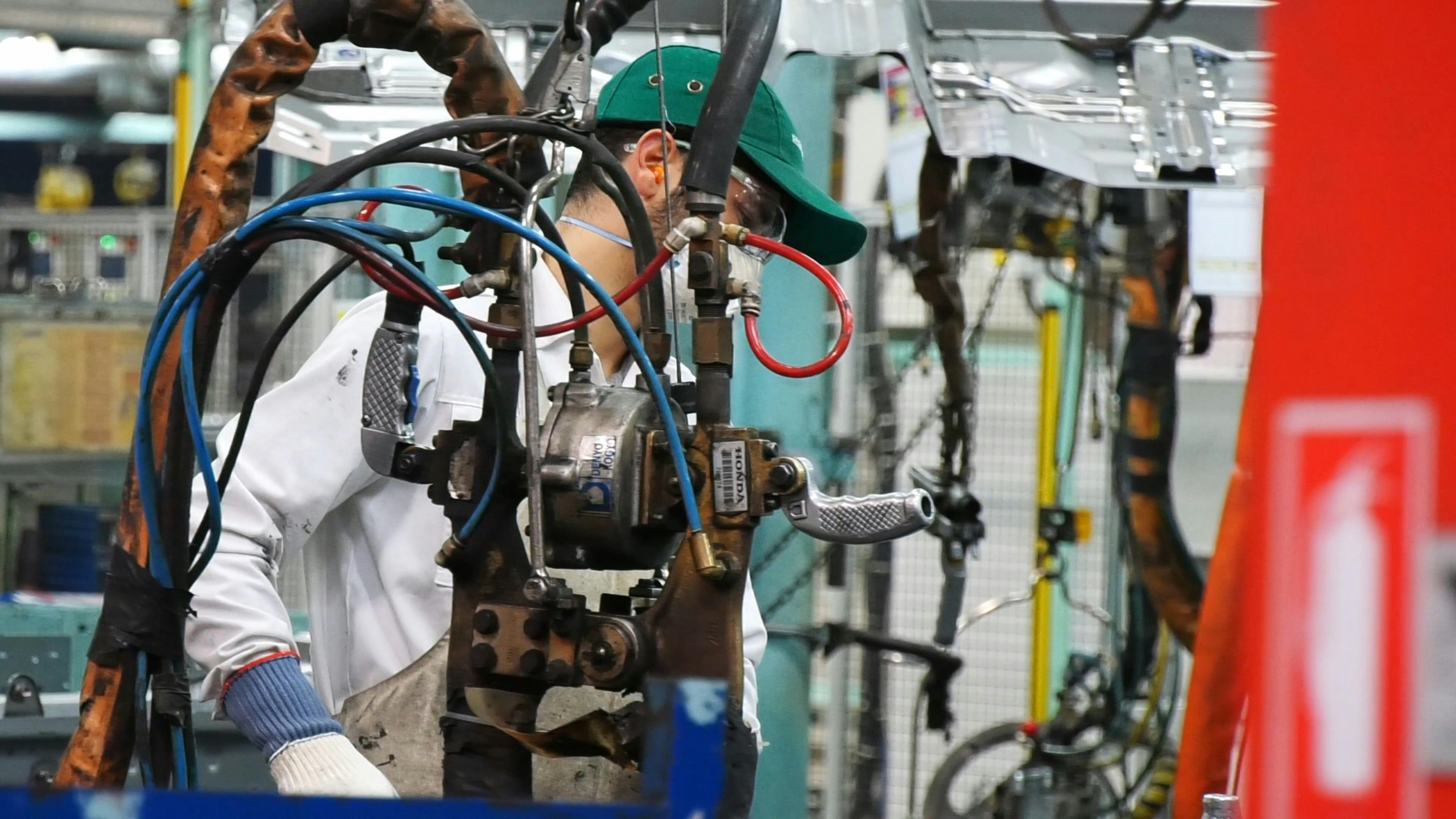 A Man Operating Equipment in the Factory · Free Stock Video