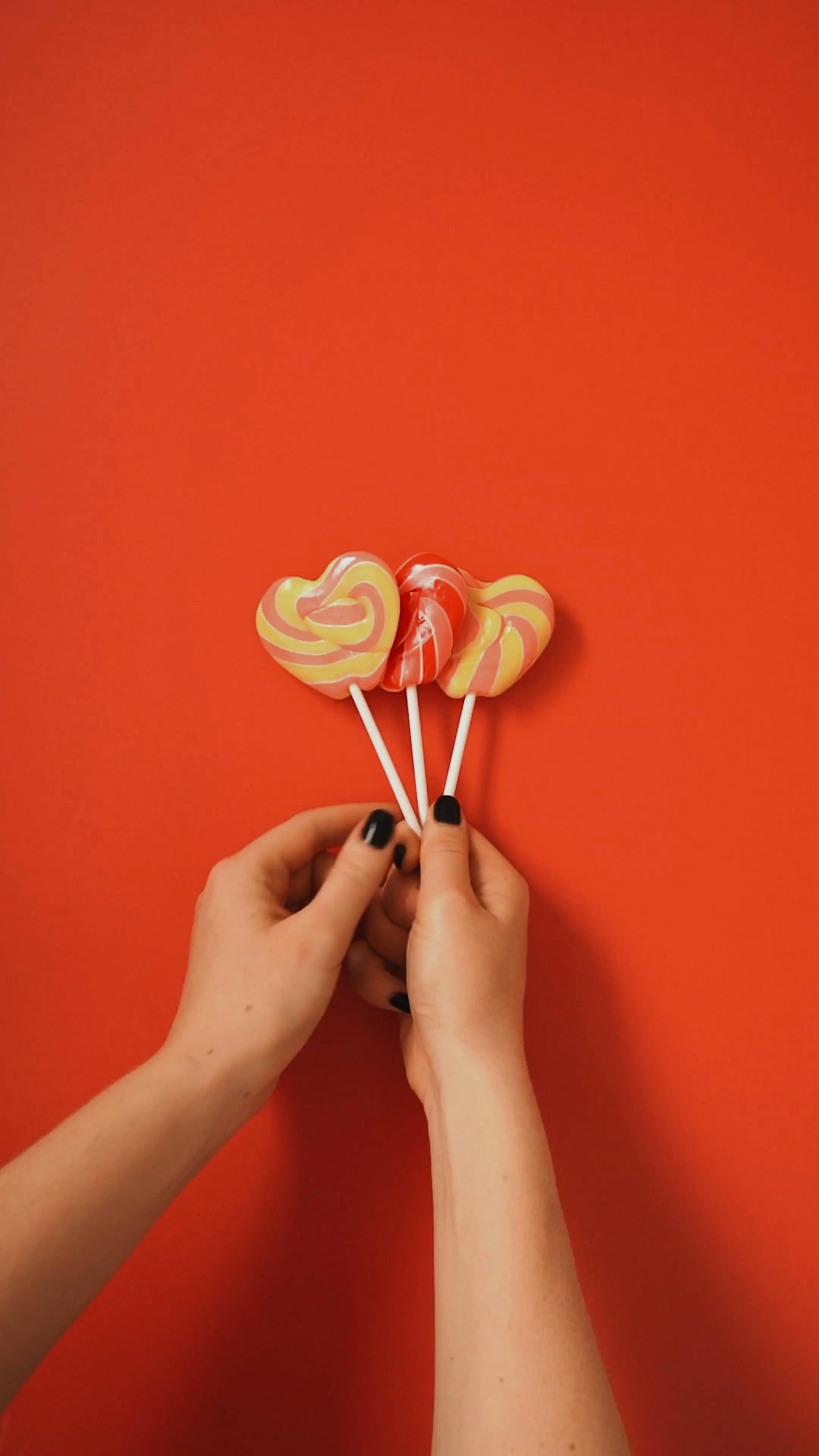 Close Up View of a Person Holding a Lollipop Free Stock Video Footage ...