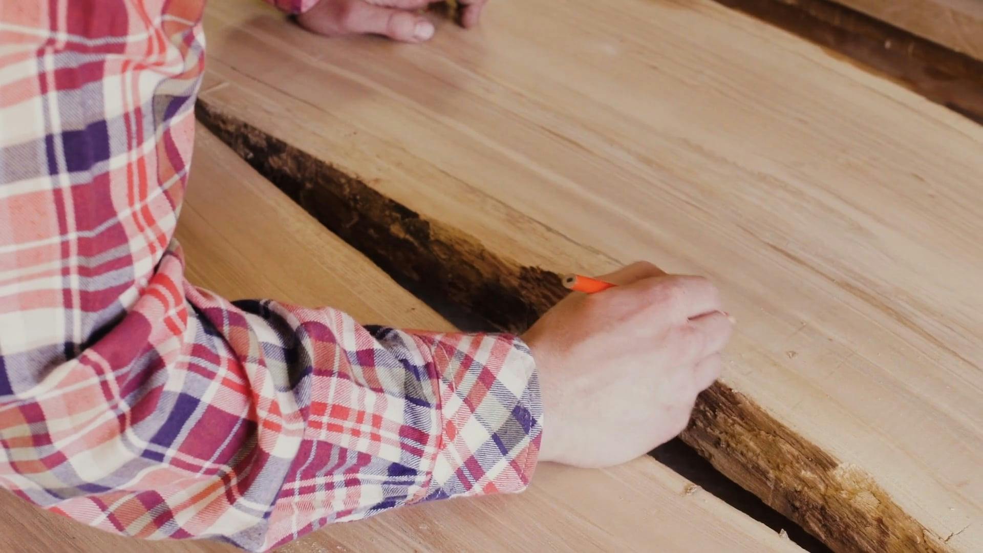 A Man Smoothing The Wood Edges Using A Sand Paper Free Stock Video ...