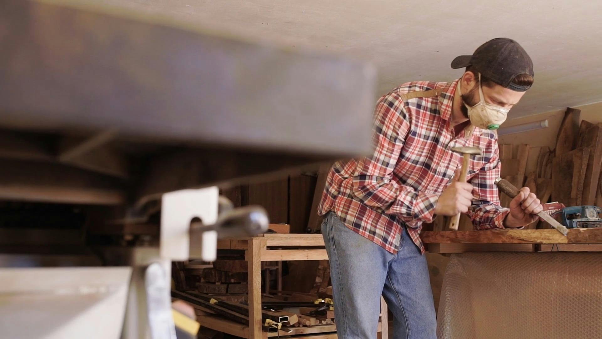 A Man Smoothing The Wood Edges Using A Sand Paper Free Stock Video ...