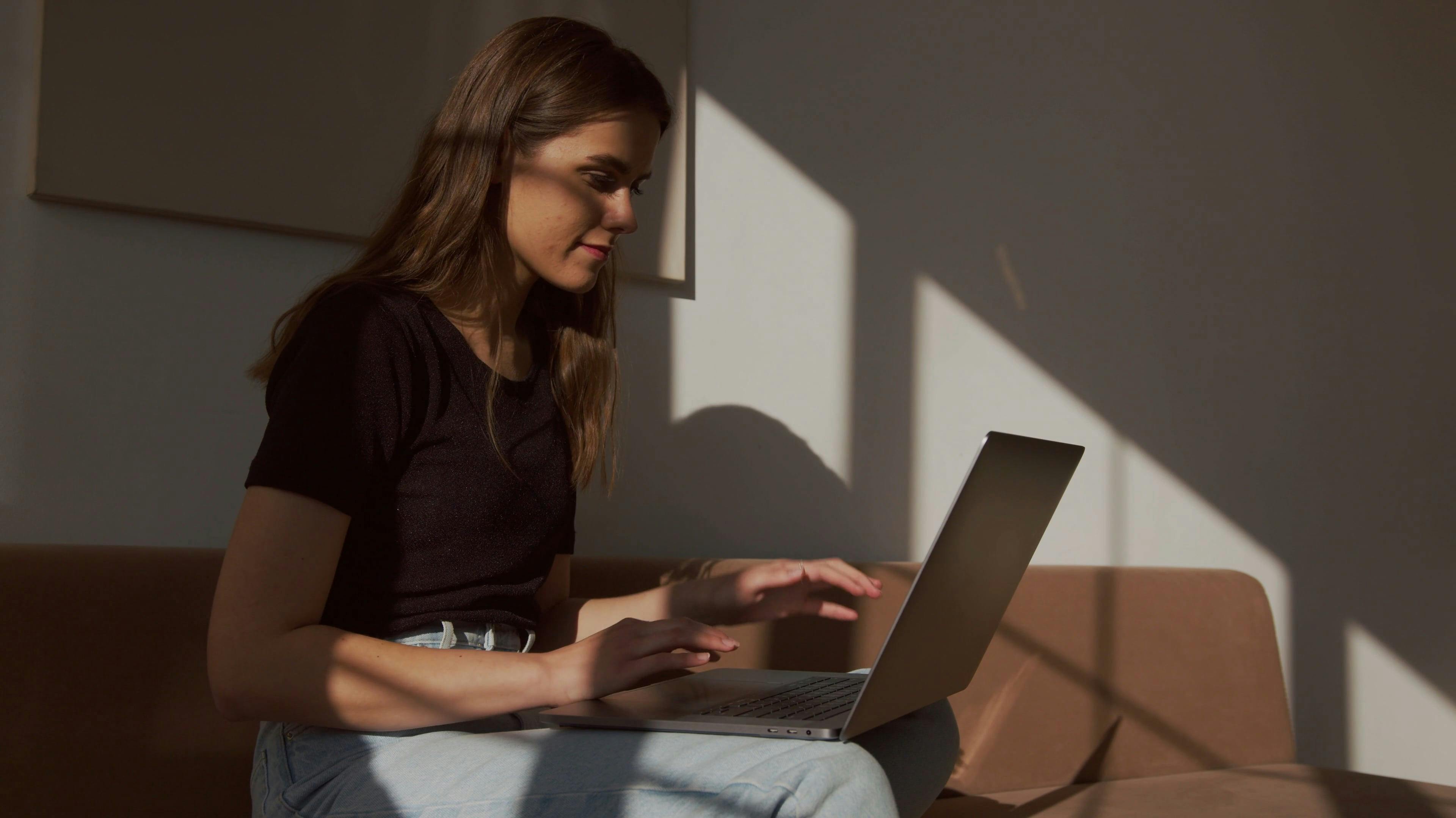 A Woman Using a Laptop at Home Free Stock Video Footage, Royalty-Free ...