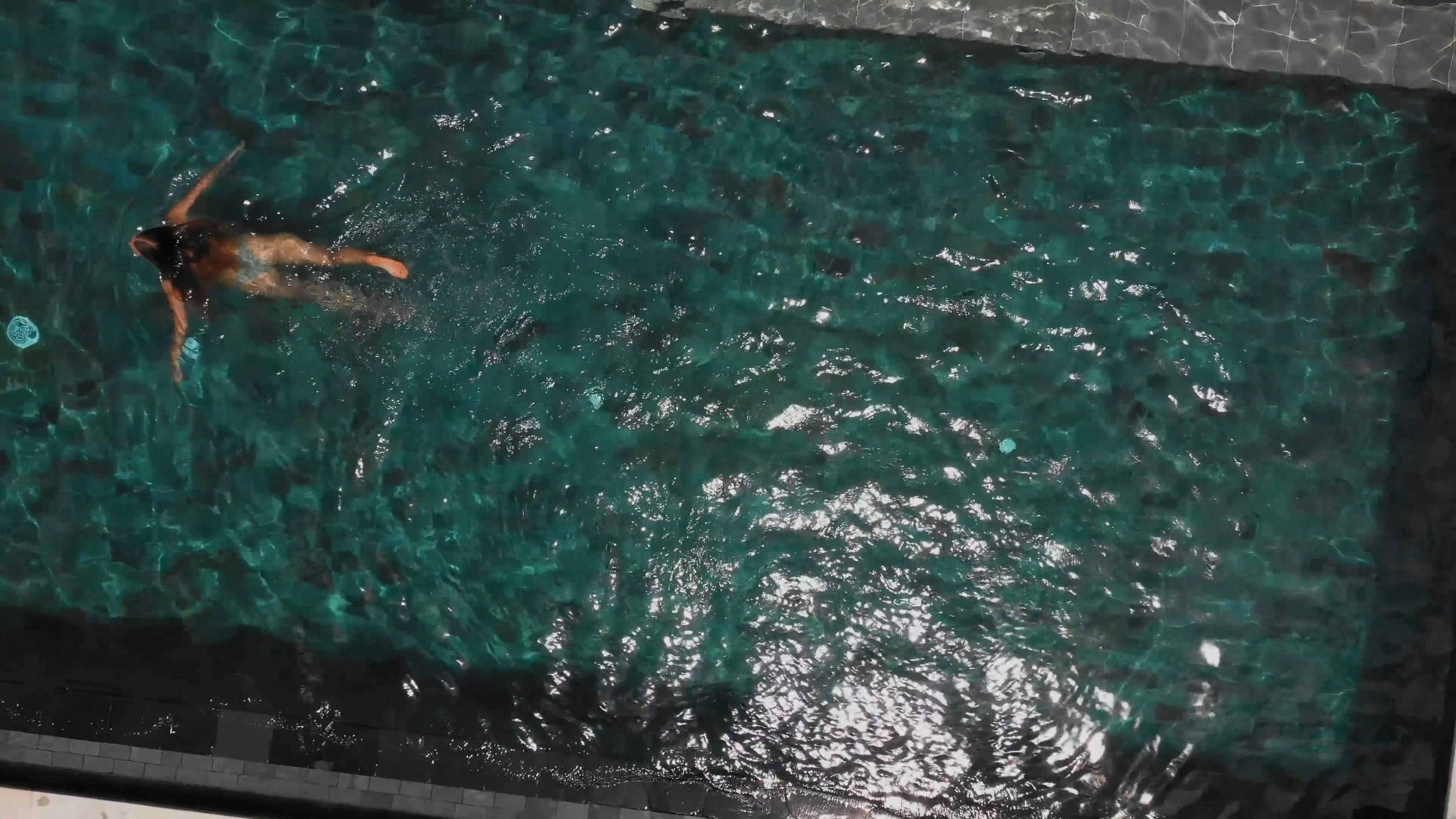 Drone Footage of Woman in Swimming Pool Free Stock Video Footage ...