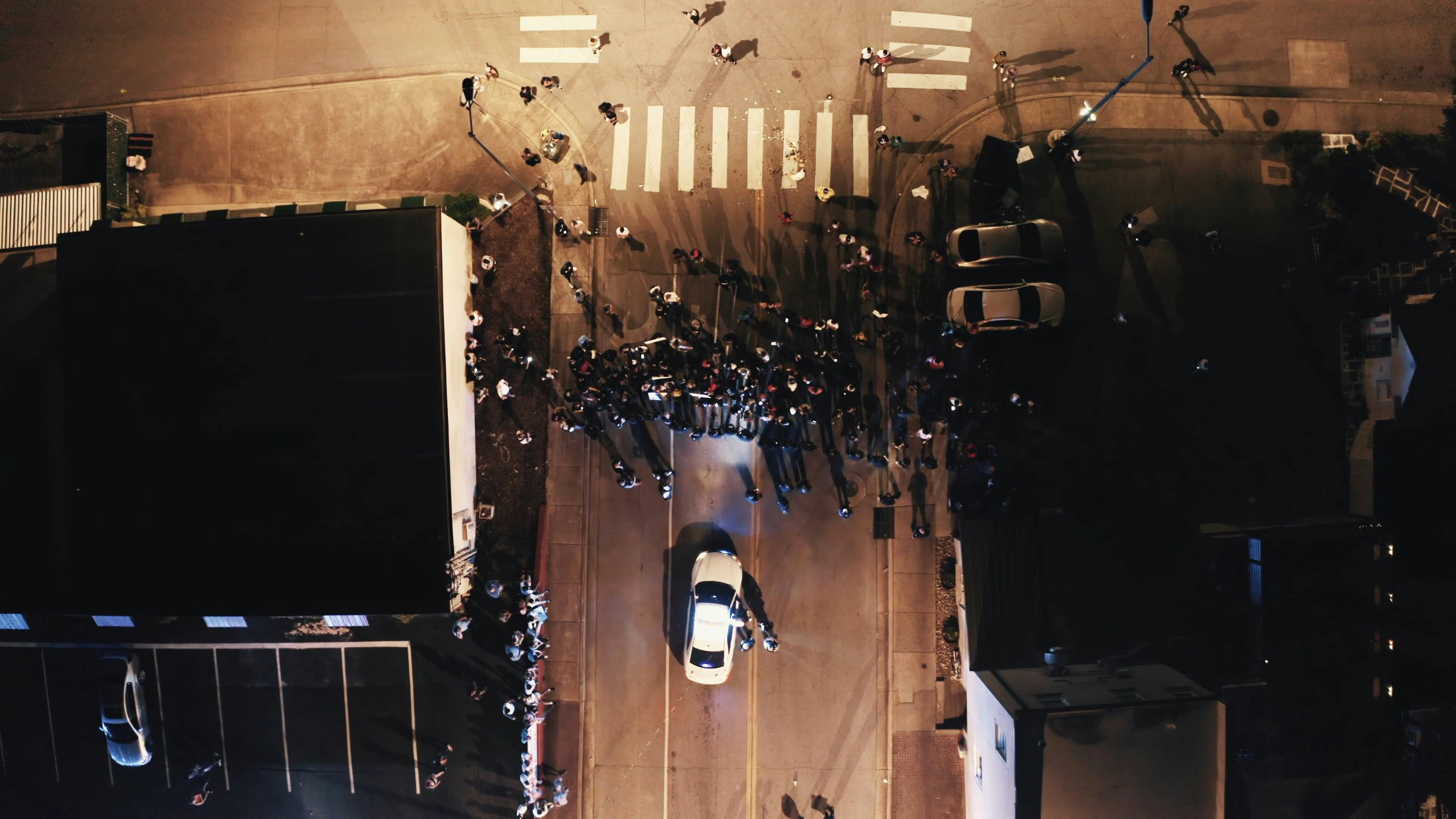 Aerial View of Protesters Walking on a Street · Free Stock Video