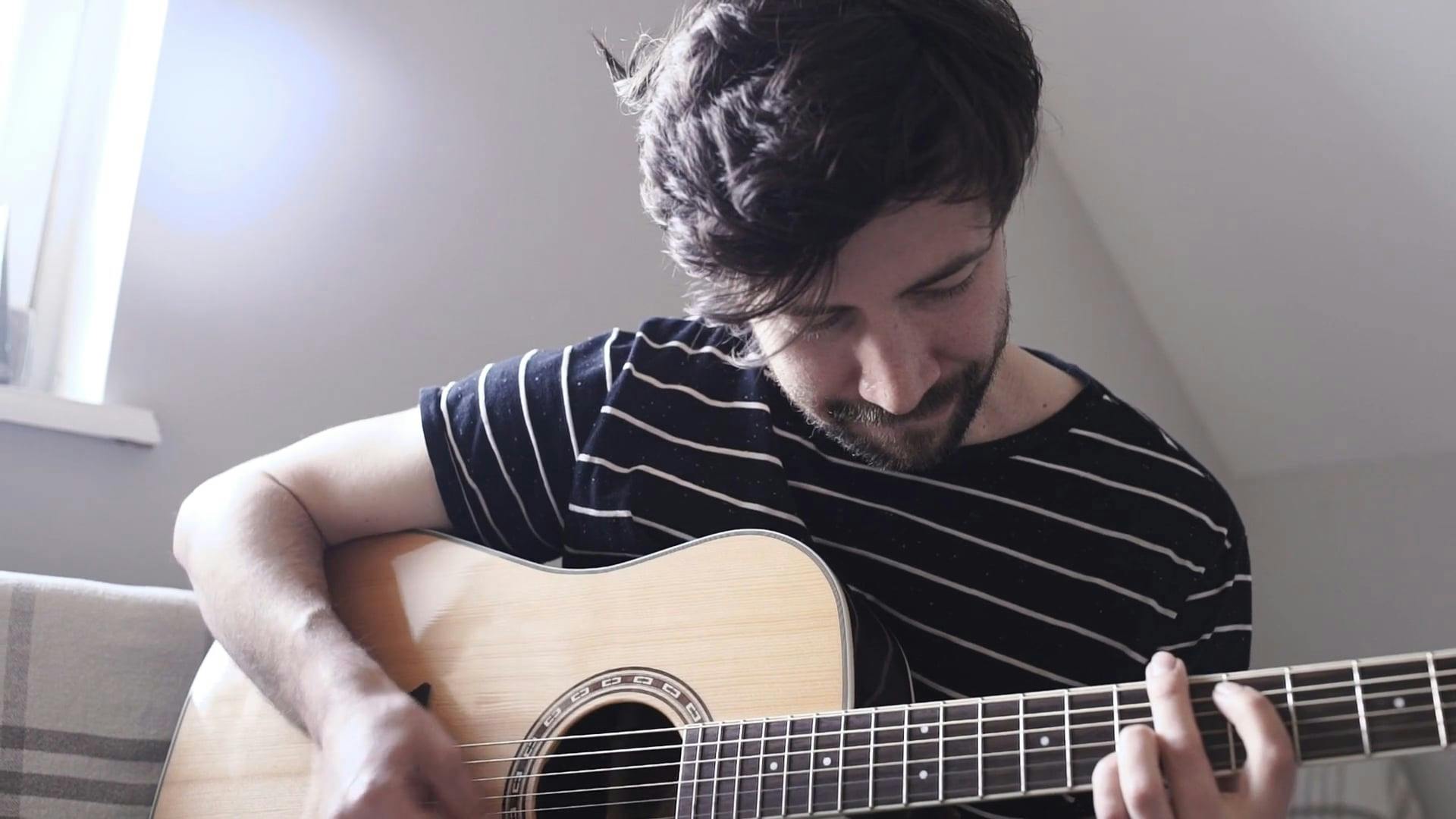 A Man Playing an Acoustic Guitar · Free Stock Video