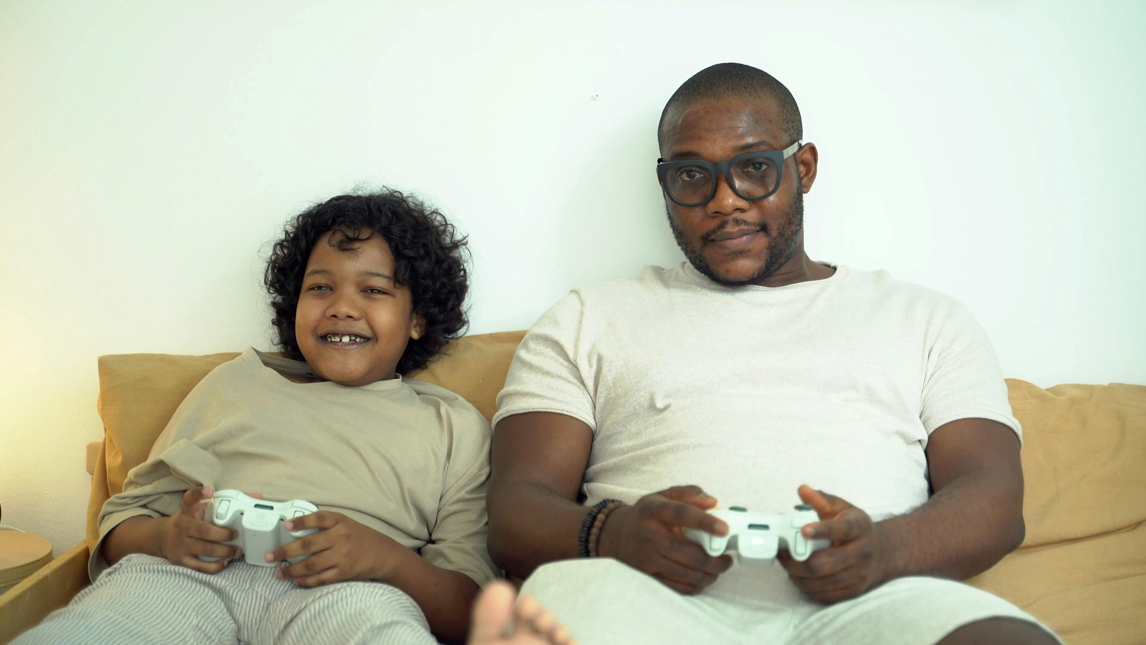 A Father and Son Playing a Video Game · Free Stock Video