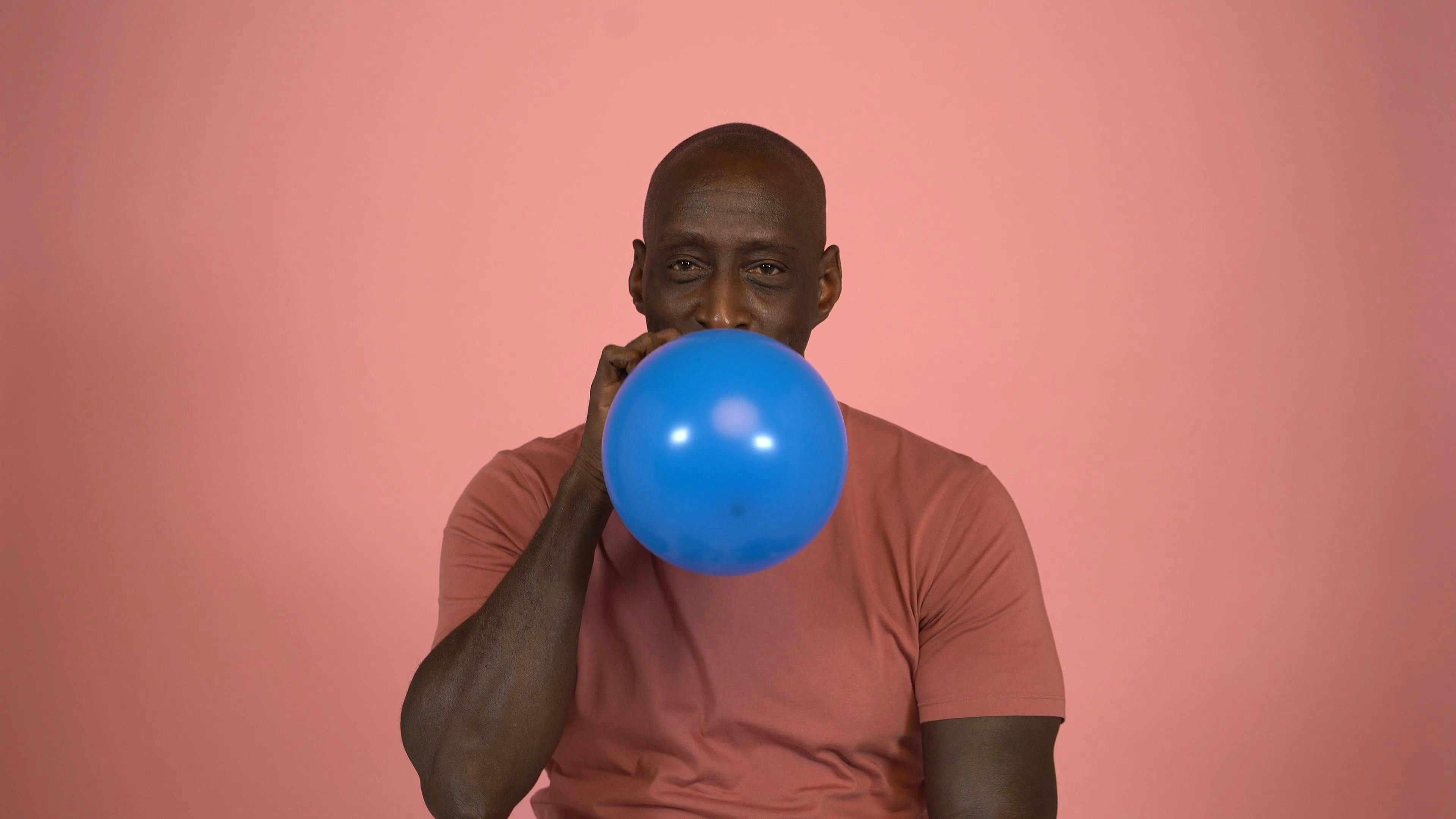 A Person Inflating a Balloon Free Stock Video Footage, Royalty-Free 4K ...