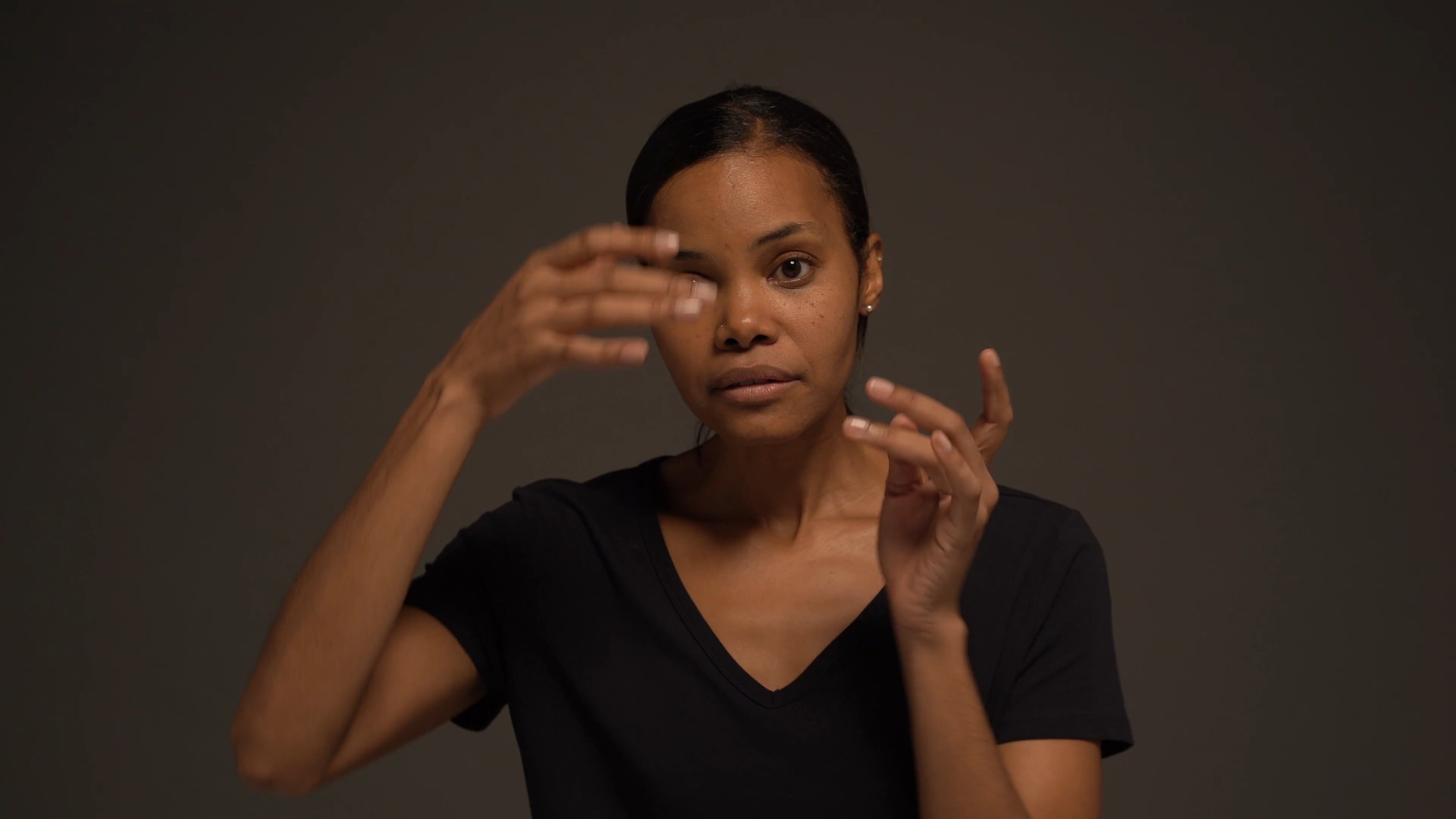 A Woman Making Hand Movements on Her Face · Free Stock Video