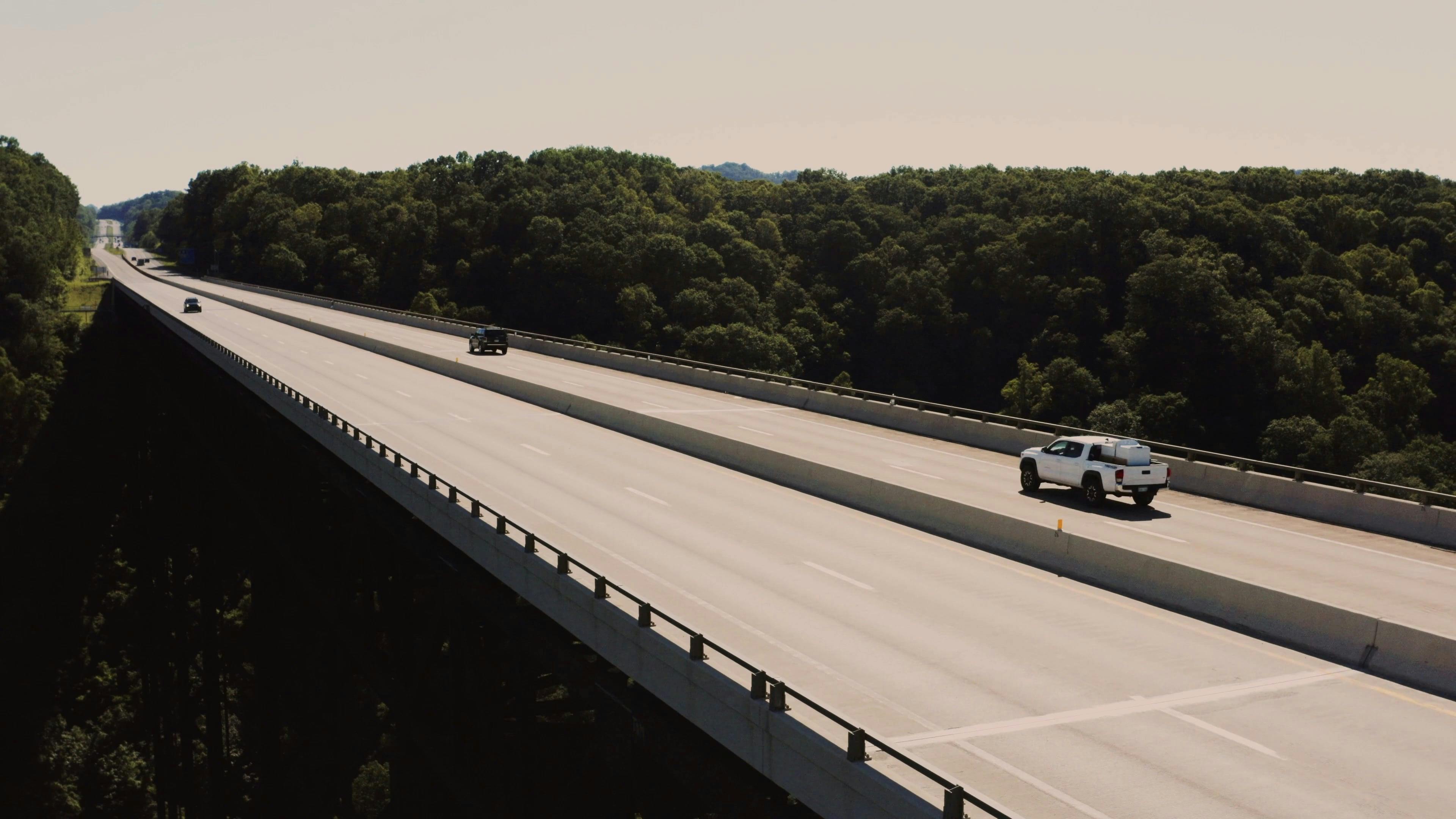 An Aerial Footage of Vehicles Crossing a Bridge · Free Stock Video