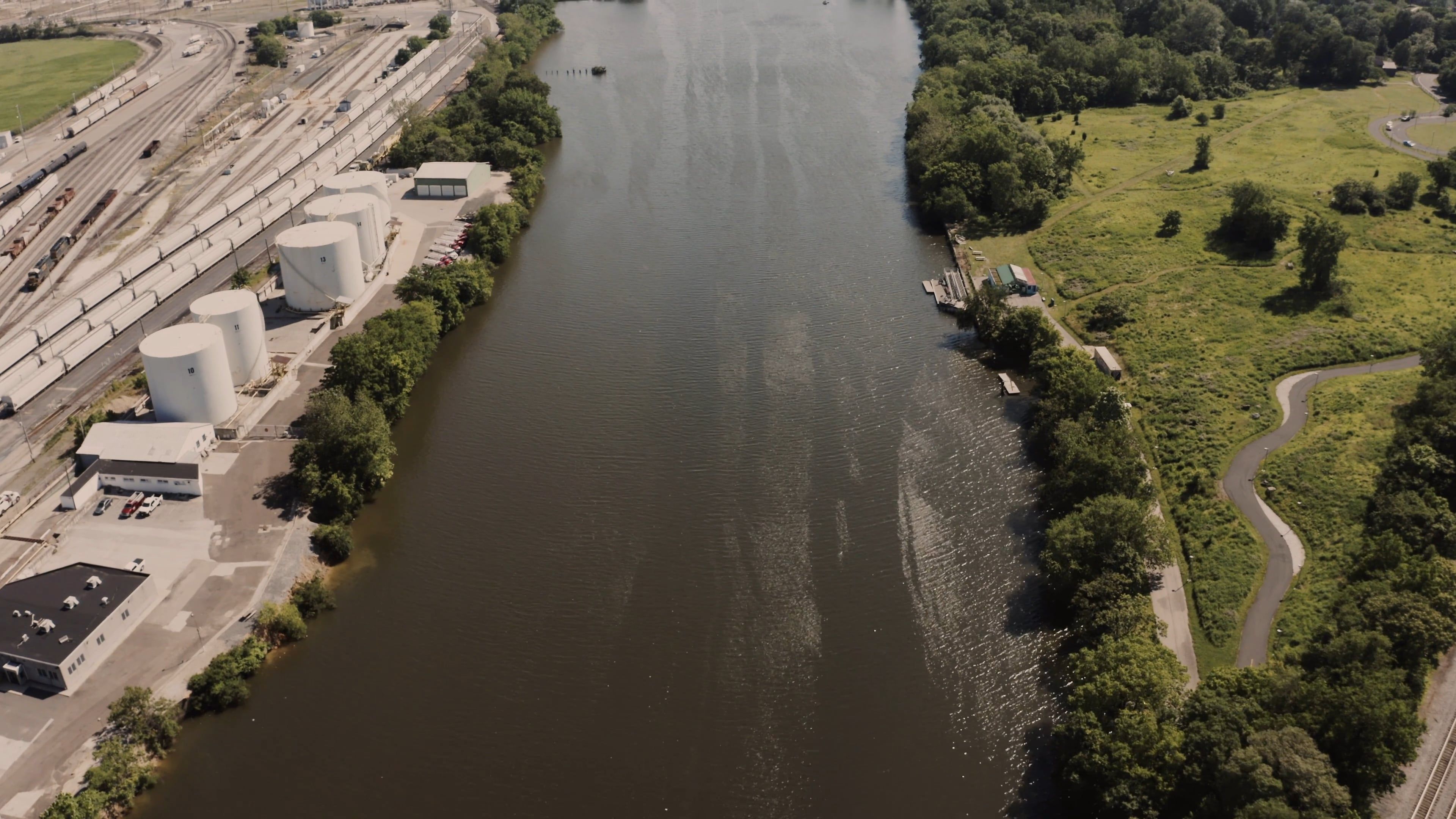 Storage Plants Built On Riverbanks · Free Stock Video
