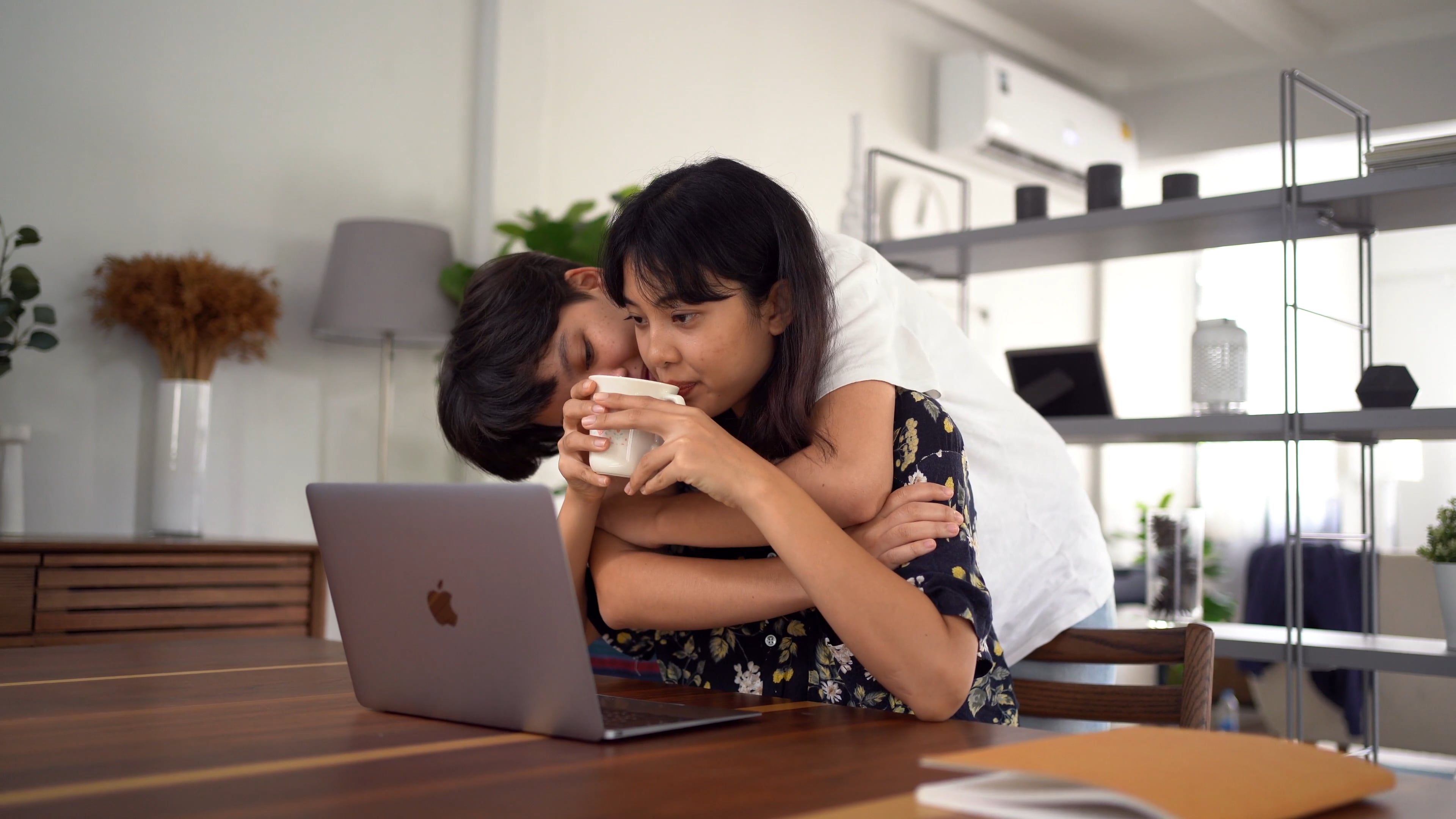 A Woman Embracing Her Partner while Working Free Stock Video Footage ...