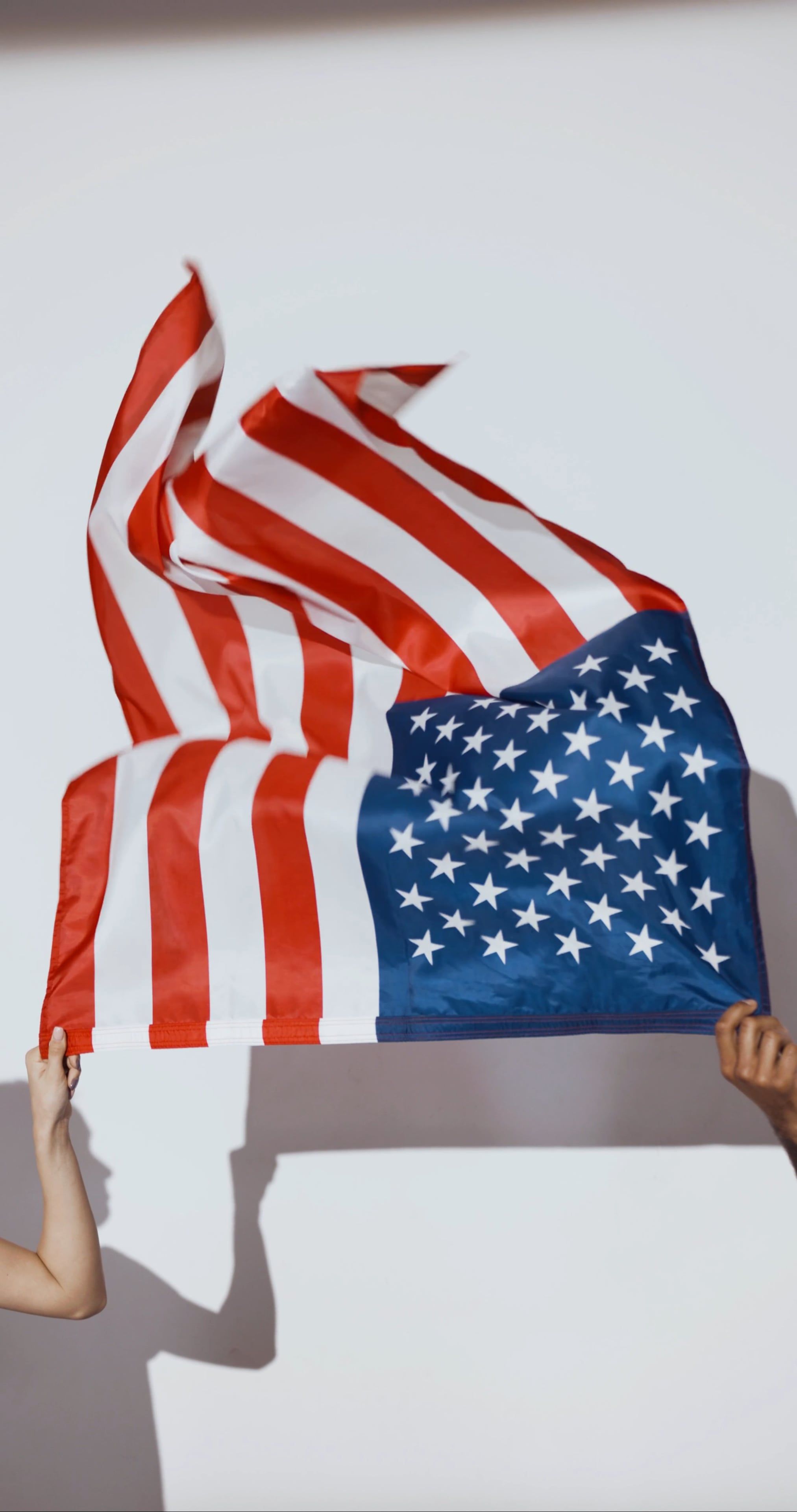Hands Holding an American Flag · Free Stock Video