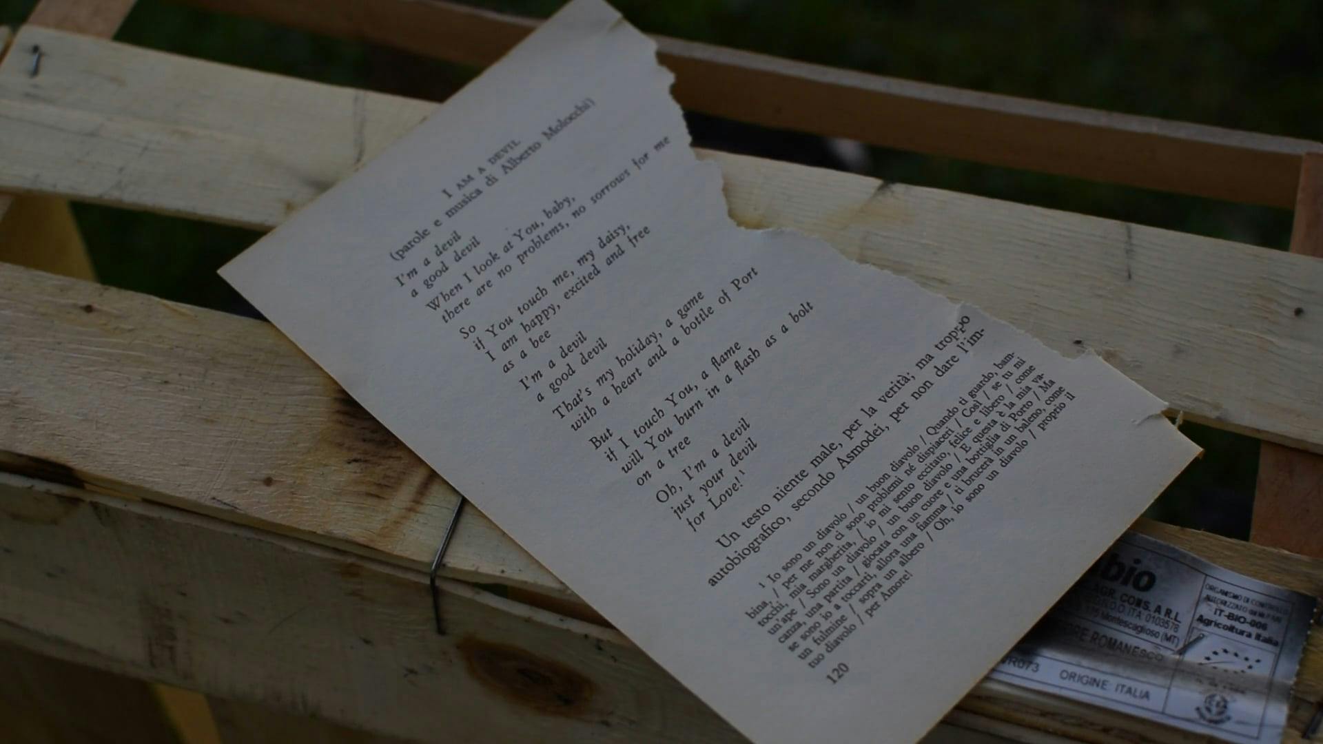 Close-Up View Of A Burning Book Page On Wooden Surface · Free Stock Video