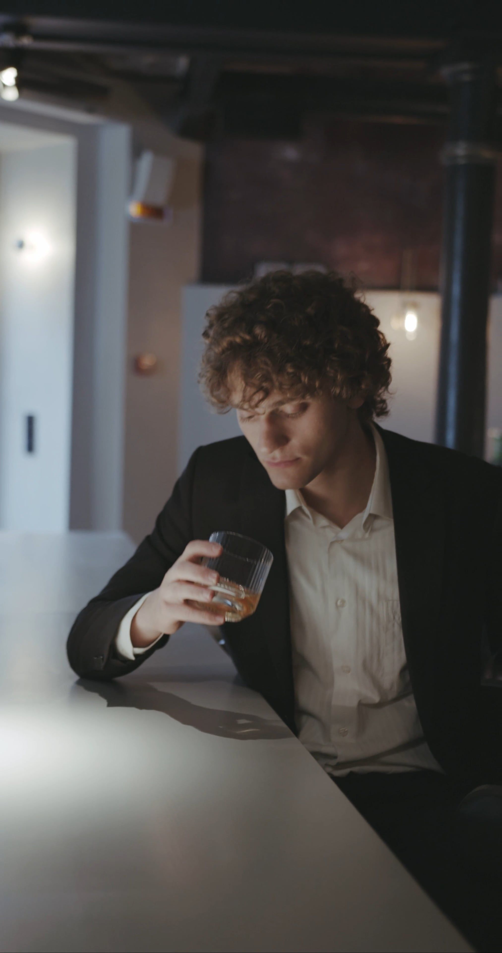 A man sitting at a table in a dark room Free Stock Video Footage ...