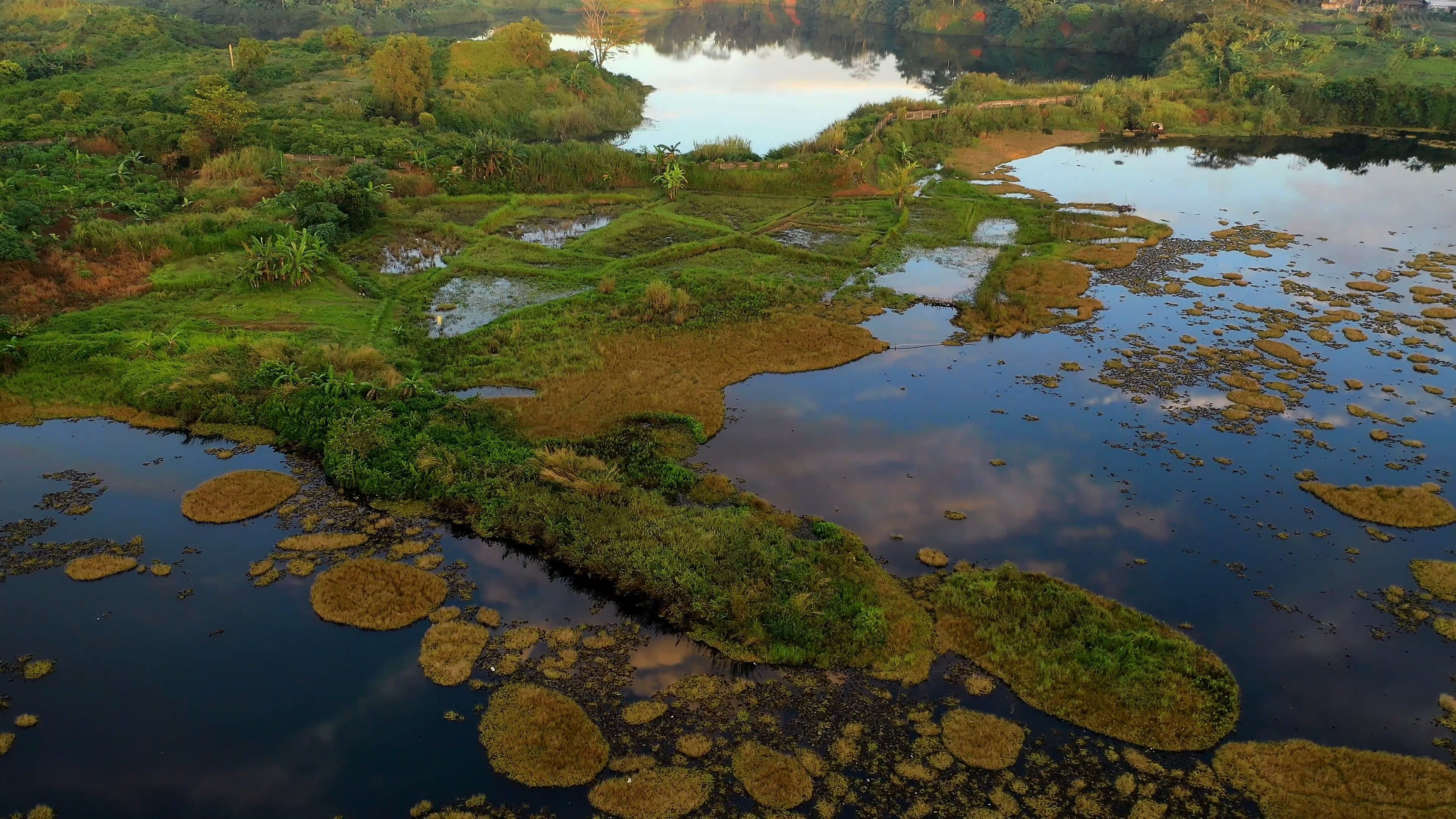 Drone View Of A Lake With Reflection Of The Blue Sky Free Stock Video ...