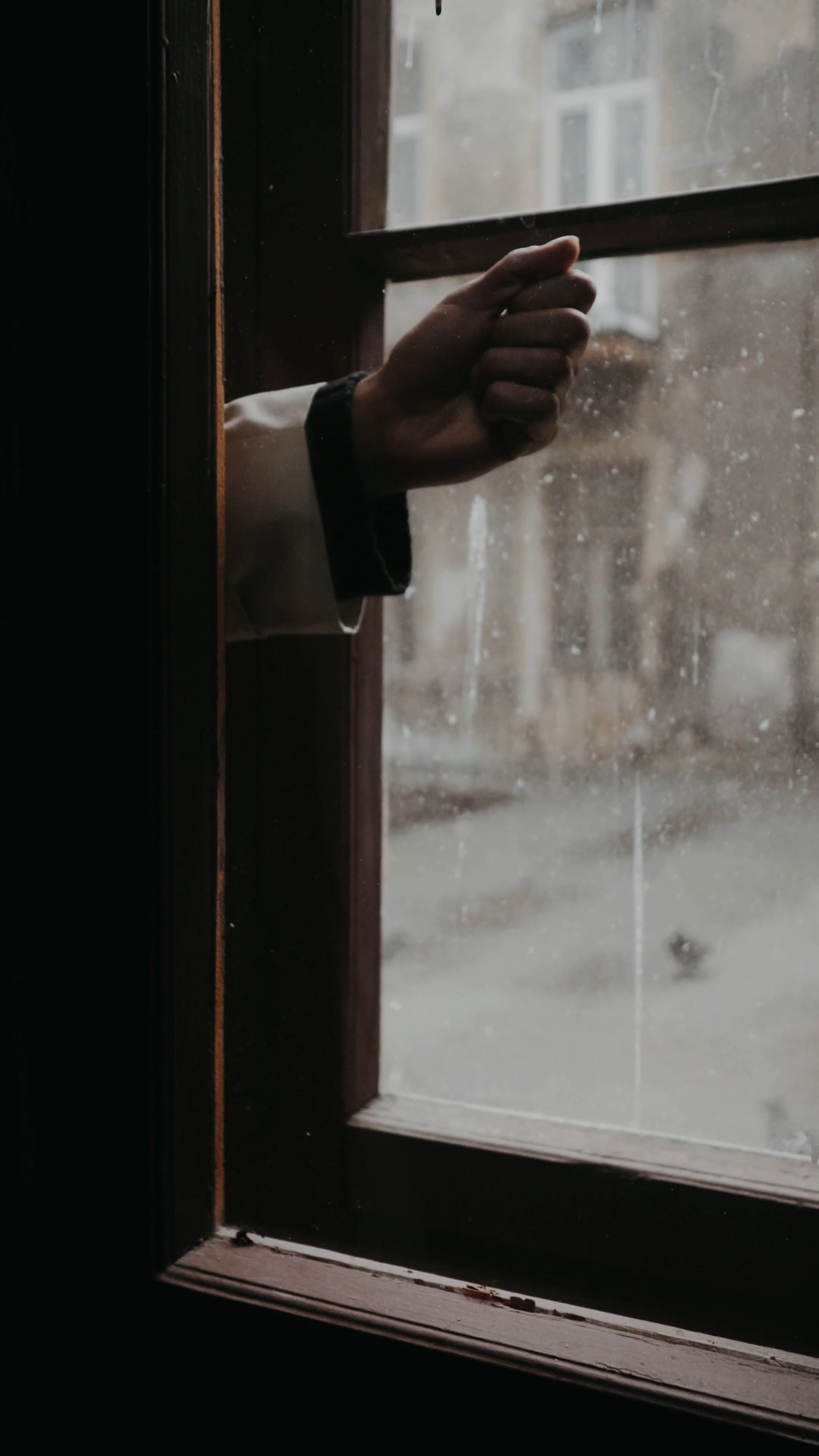 A person looking out of a window at the rain Free Stock Video Footage ...