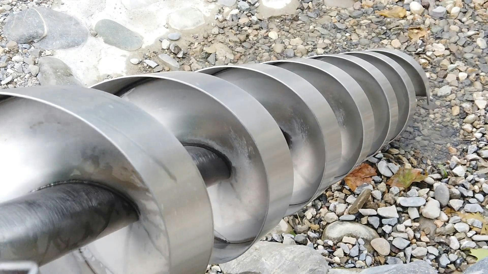 Close-up View Of A Long Spiral Drilling Equipment · Free Stock Video
