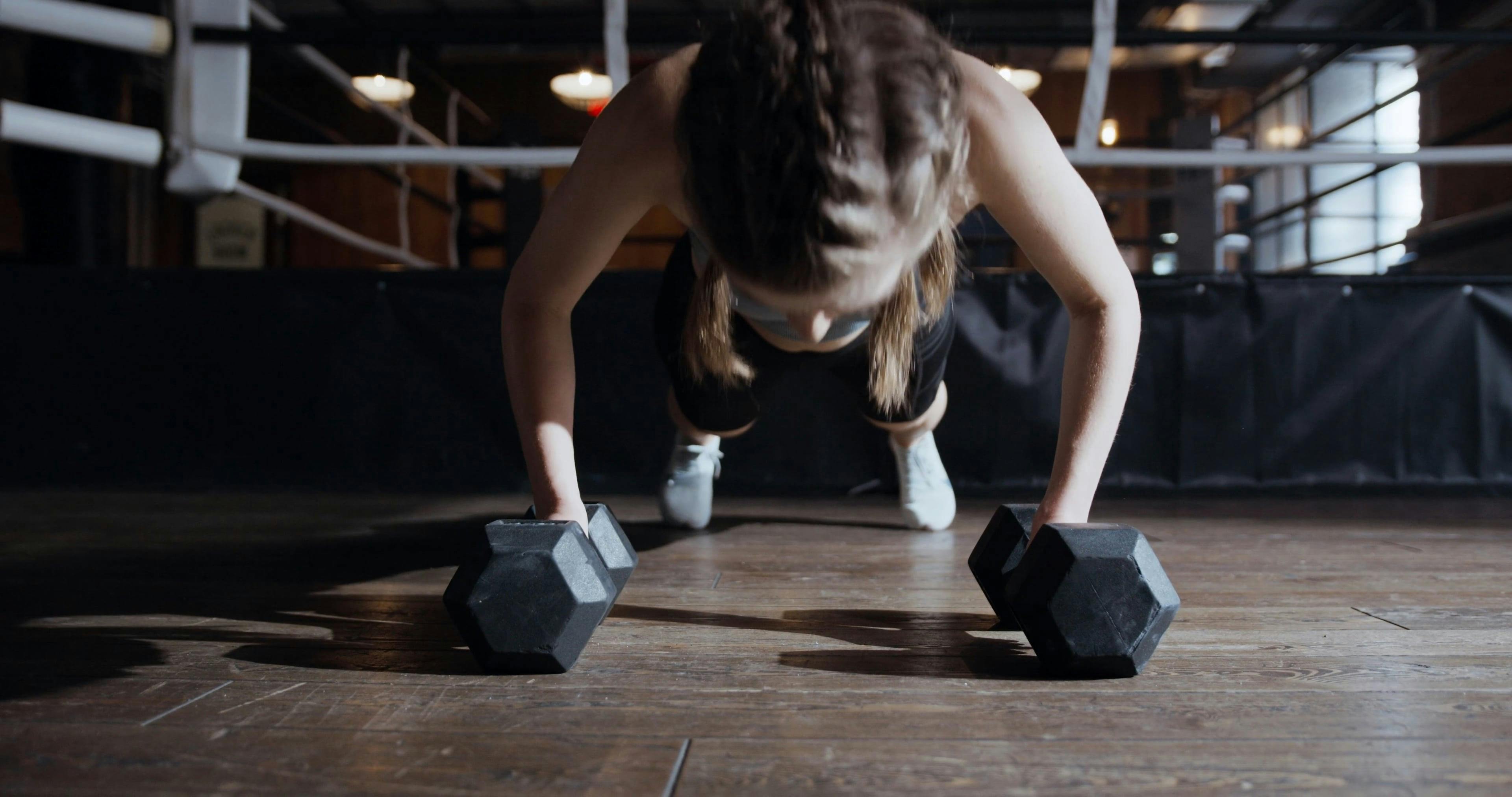 A woman doing push ups on a boxing ring Free Stock Video Footage ...