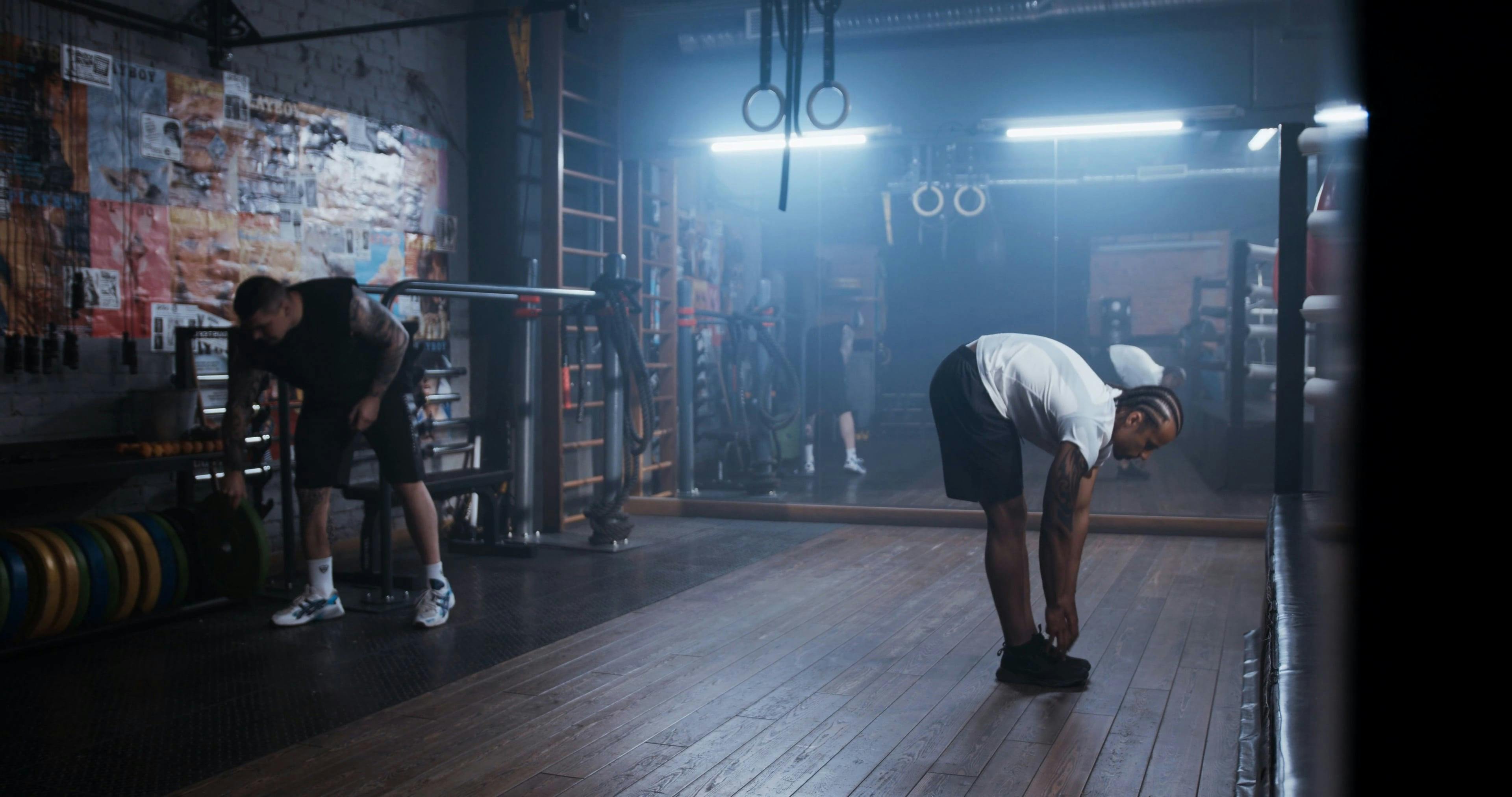 Two Men Exercising In A Gym · Free Stock Video