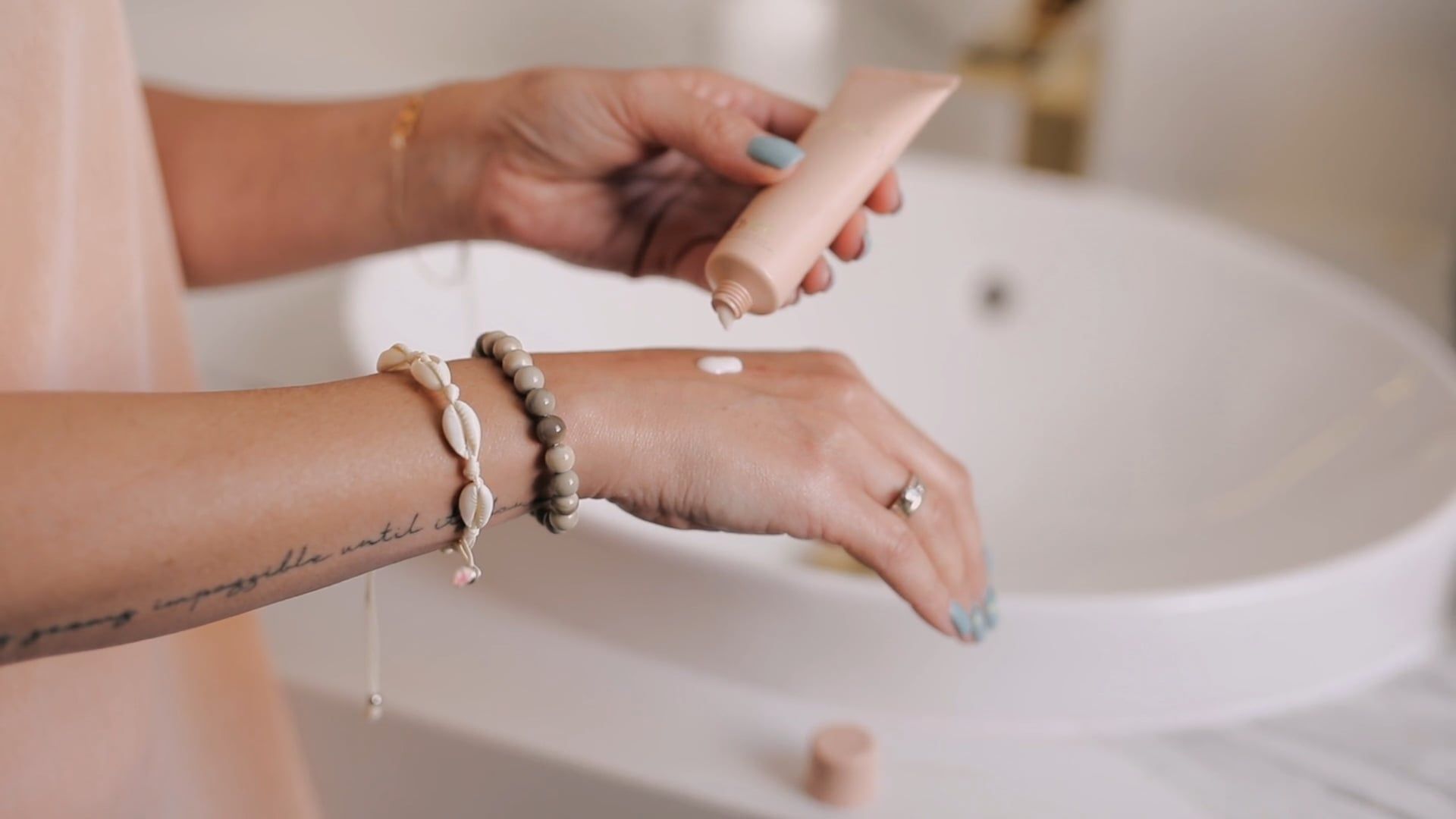 A Woman Rubbing Lotion At The Back Of Her Hand Free Stock Video Footage ...