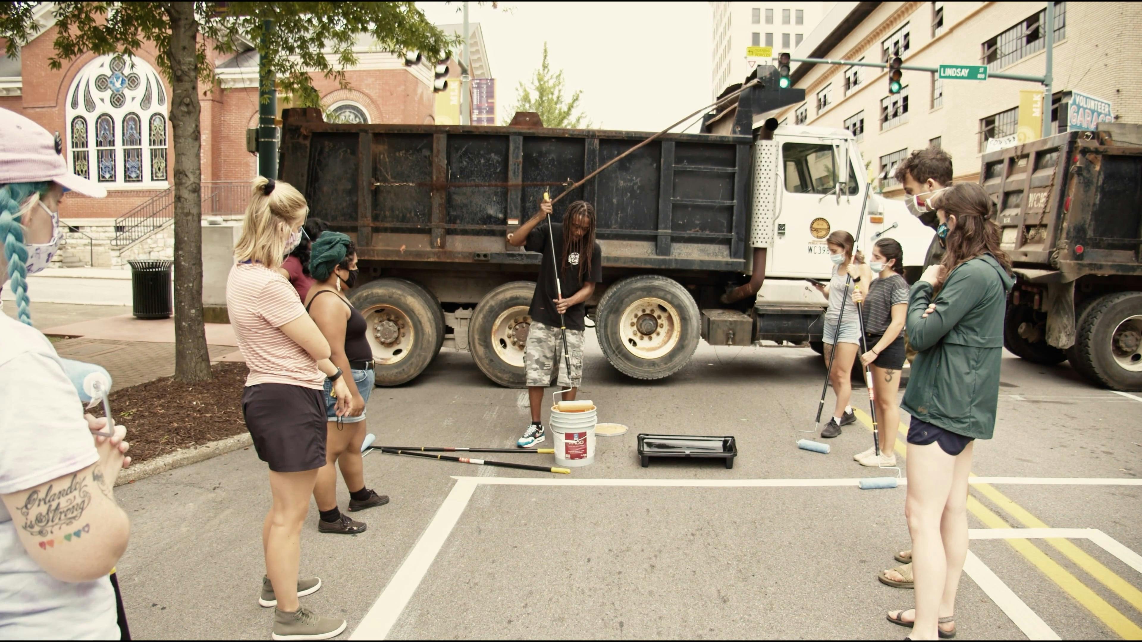A Group Of People Making A Street Mural Painting Free Stock Video ...