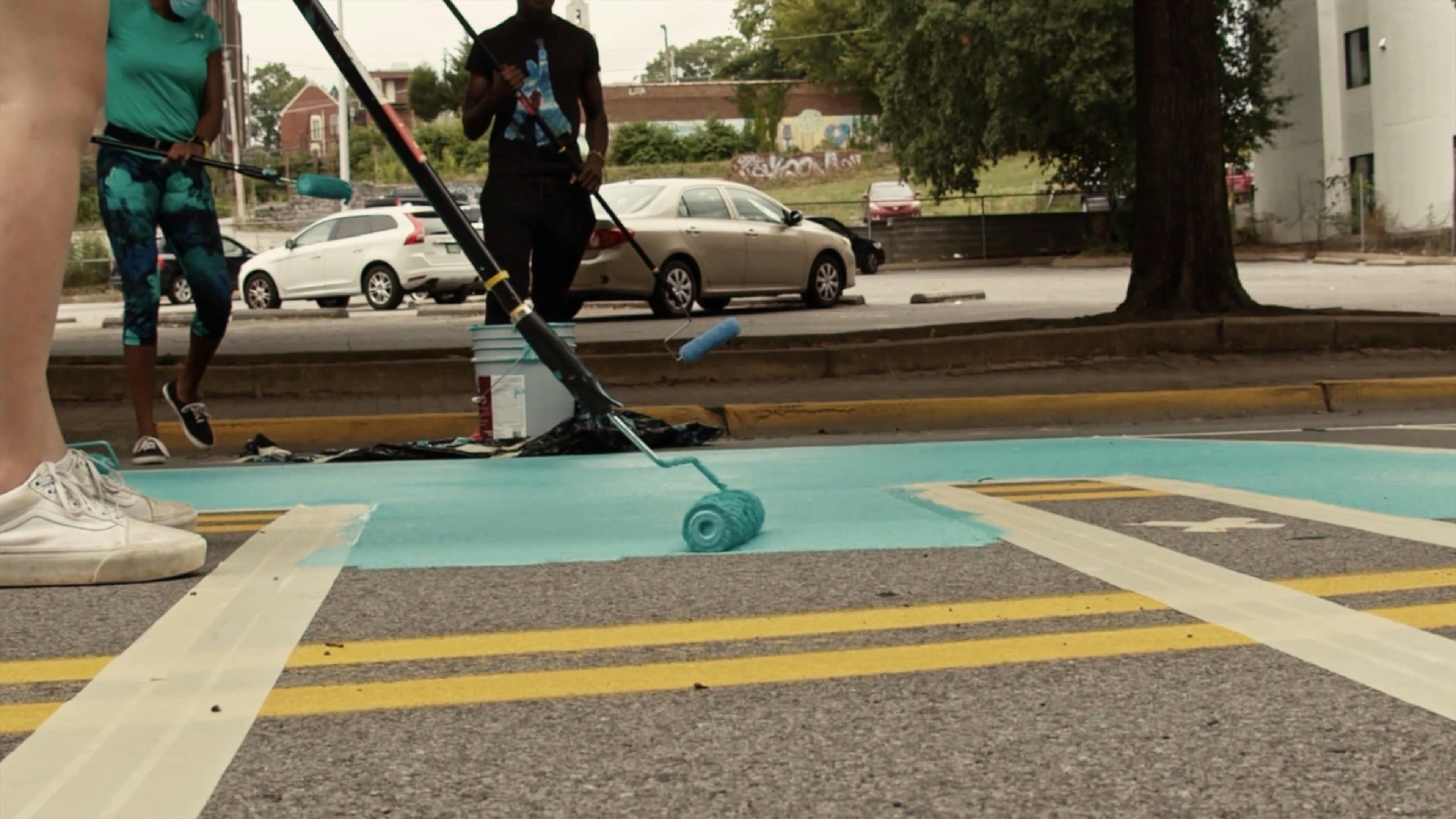 A Person Painting The Street With Blue Color · Free Stock Video