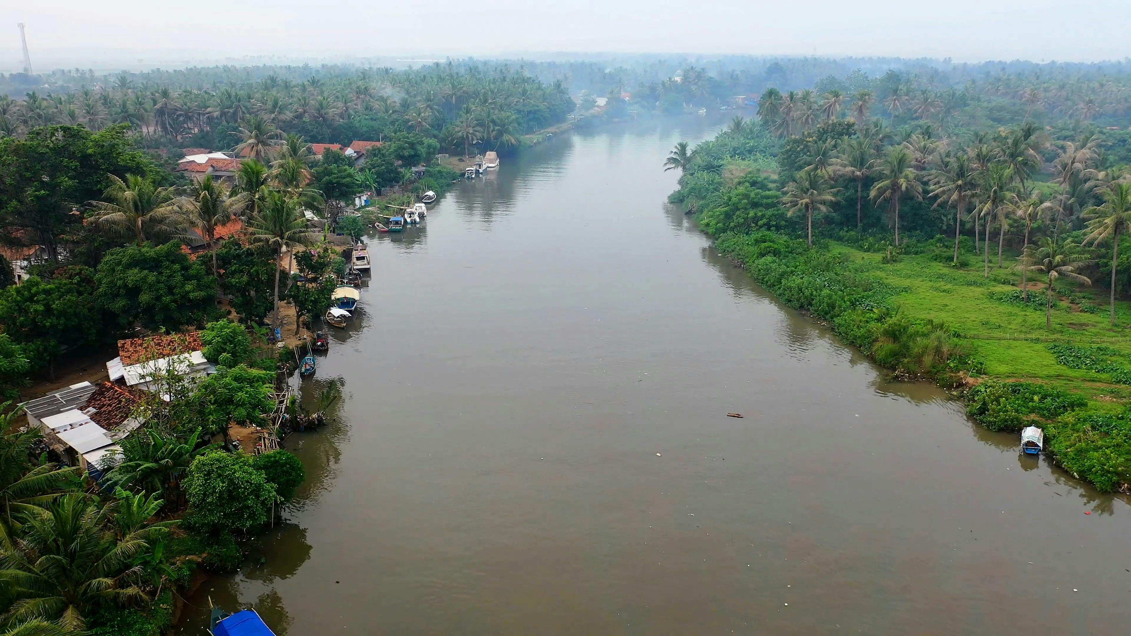 Drone View Of A River Between Two Farmlands Free Stock Video Footage ...