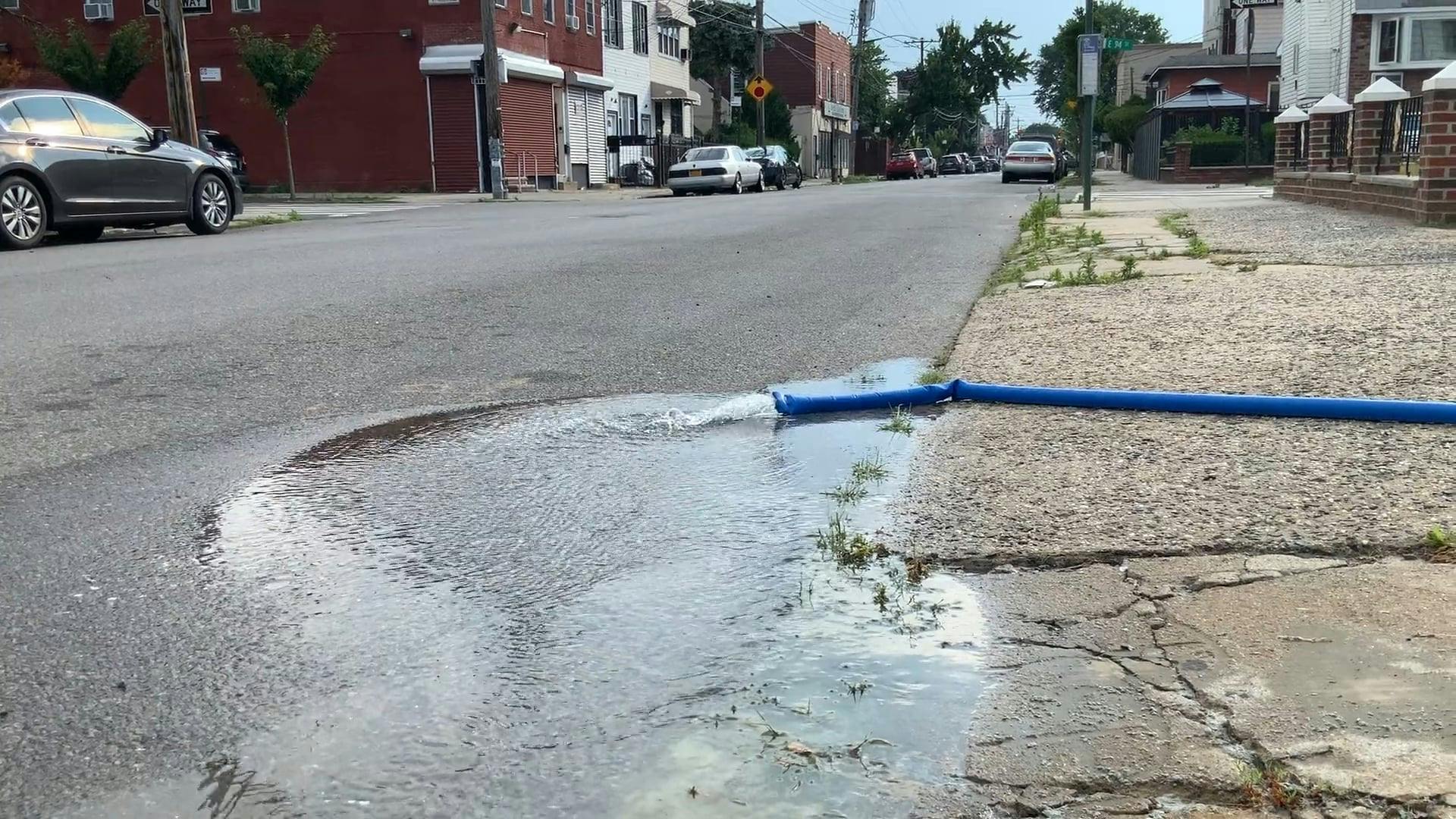 Water Flowing Out of Hose on Street · Free Stock Video