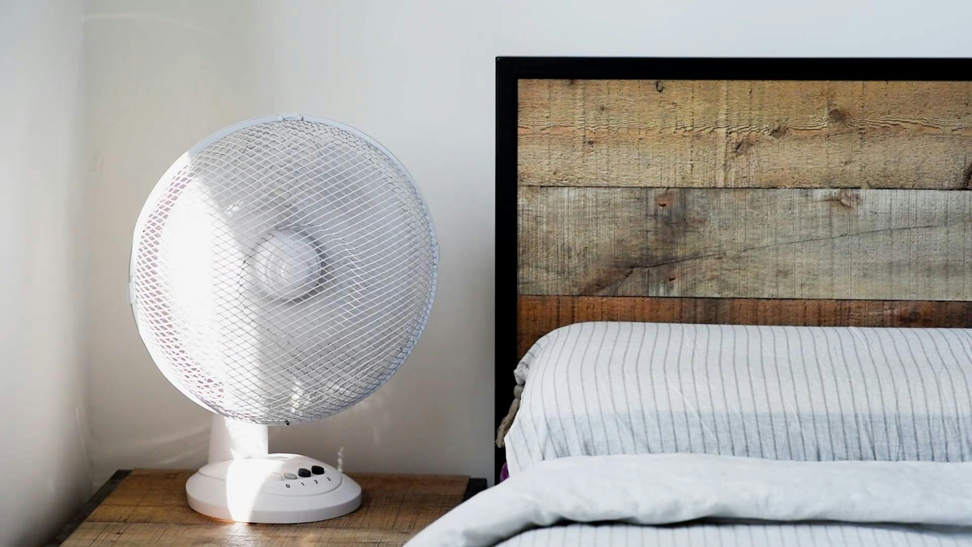 White Electric Fan on Bedside Table · Free Stock Video