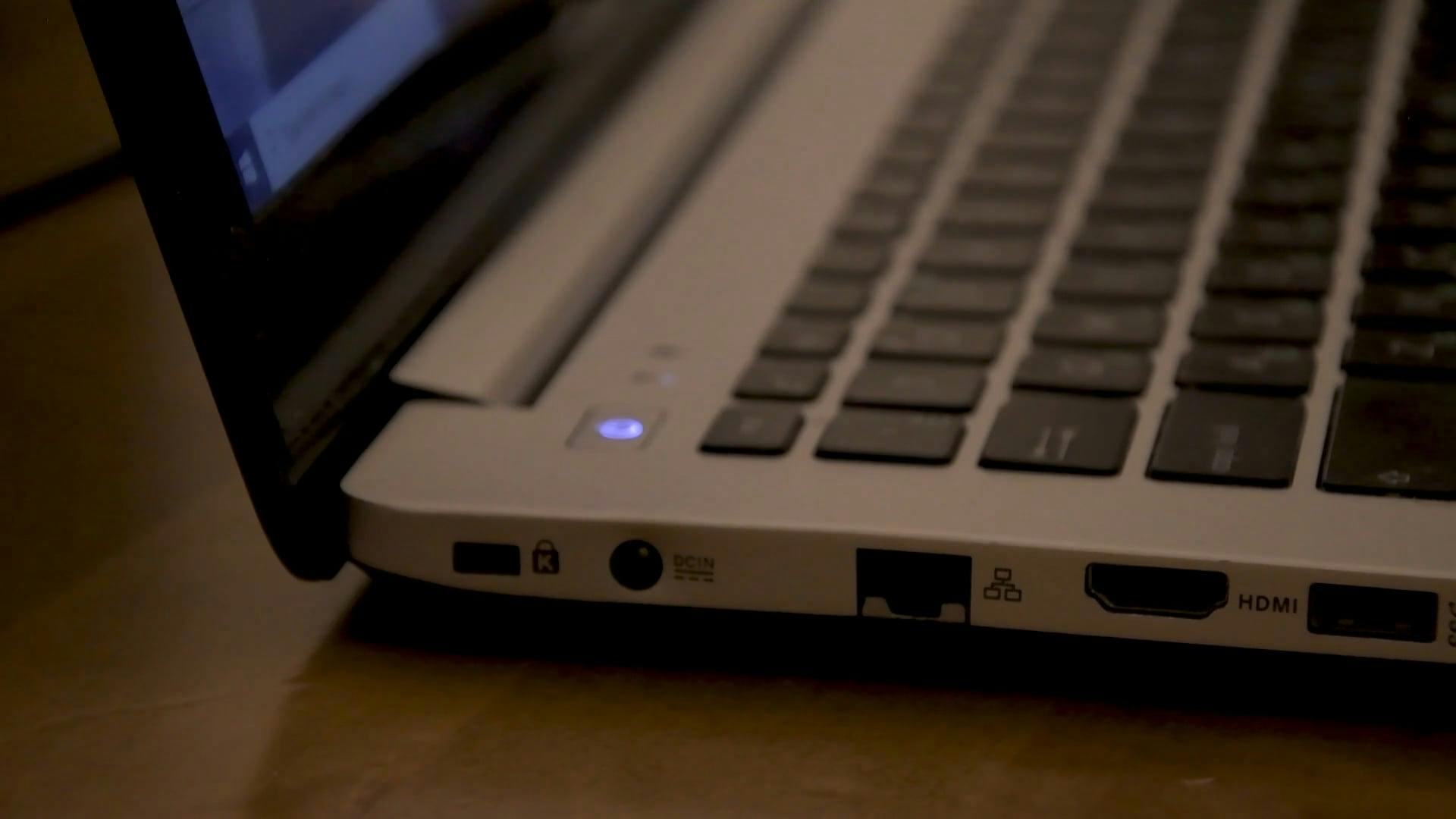 Close-Up View of Person Plugging a Cable Charger into a Laptop · Free ...