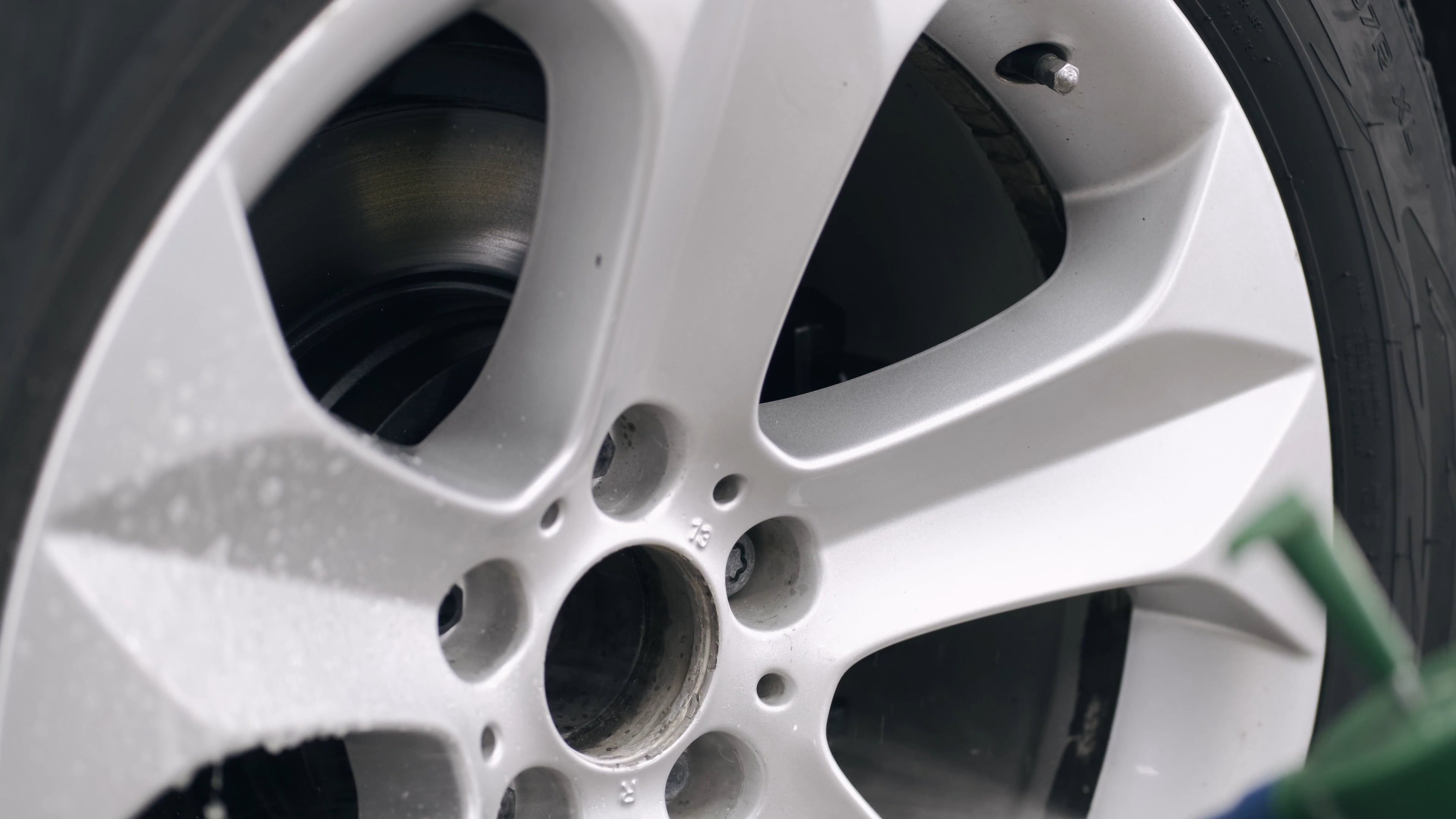 Person Cleaning Car Wheel · Free Stock Video