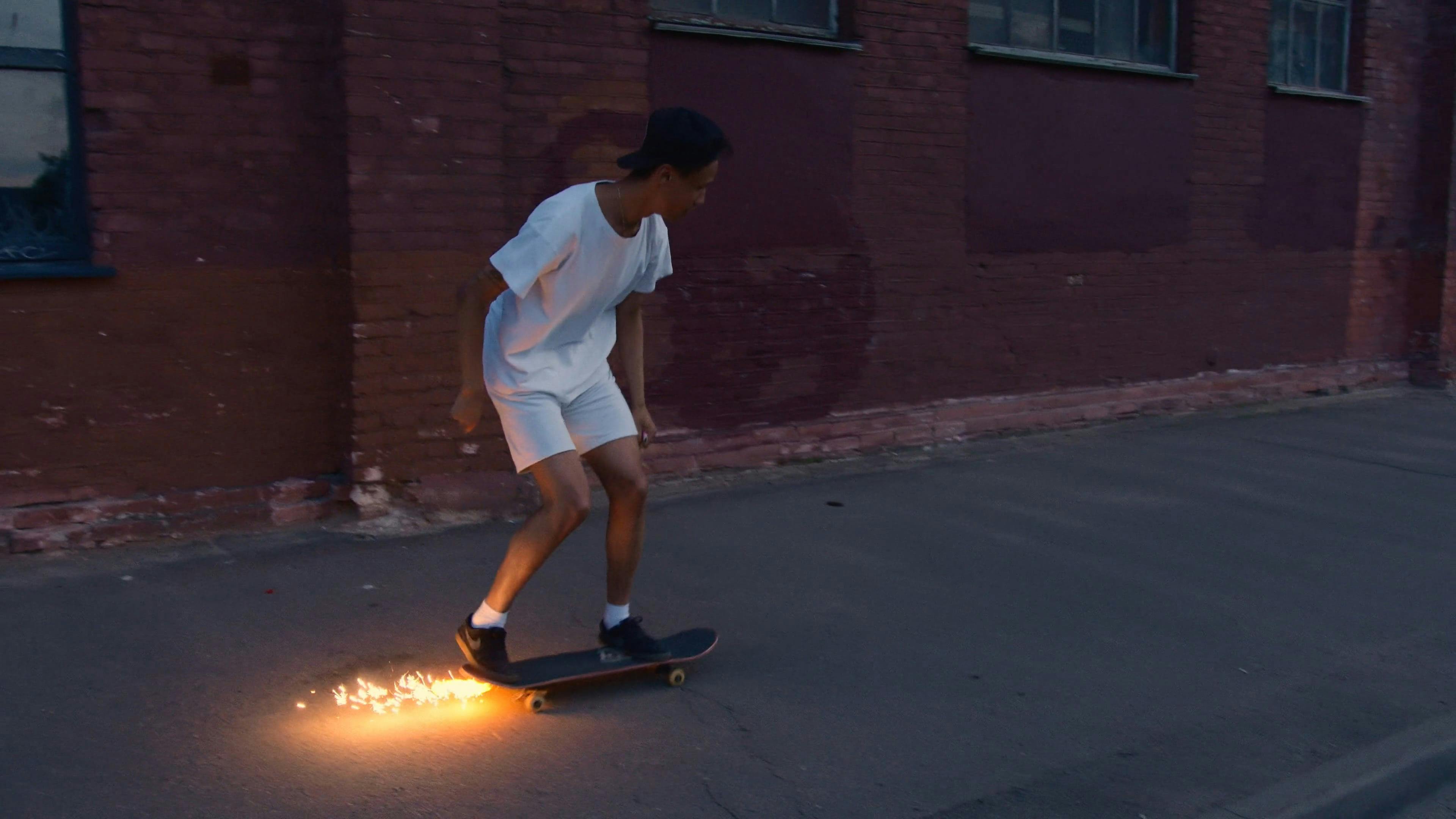 Young Man Ridding a Skateboard with Firework on the Street · Free Stock ...