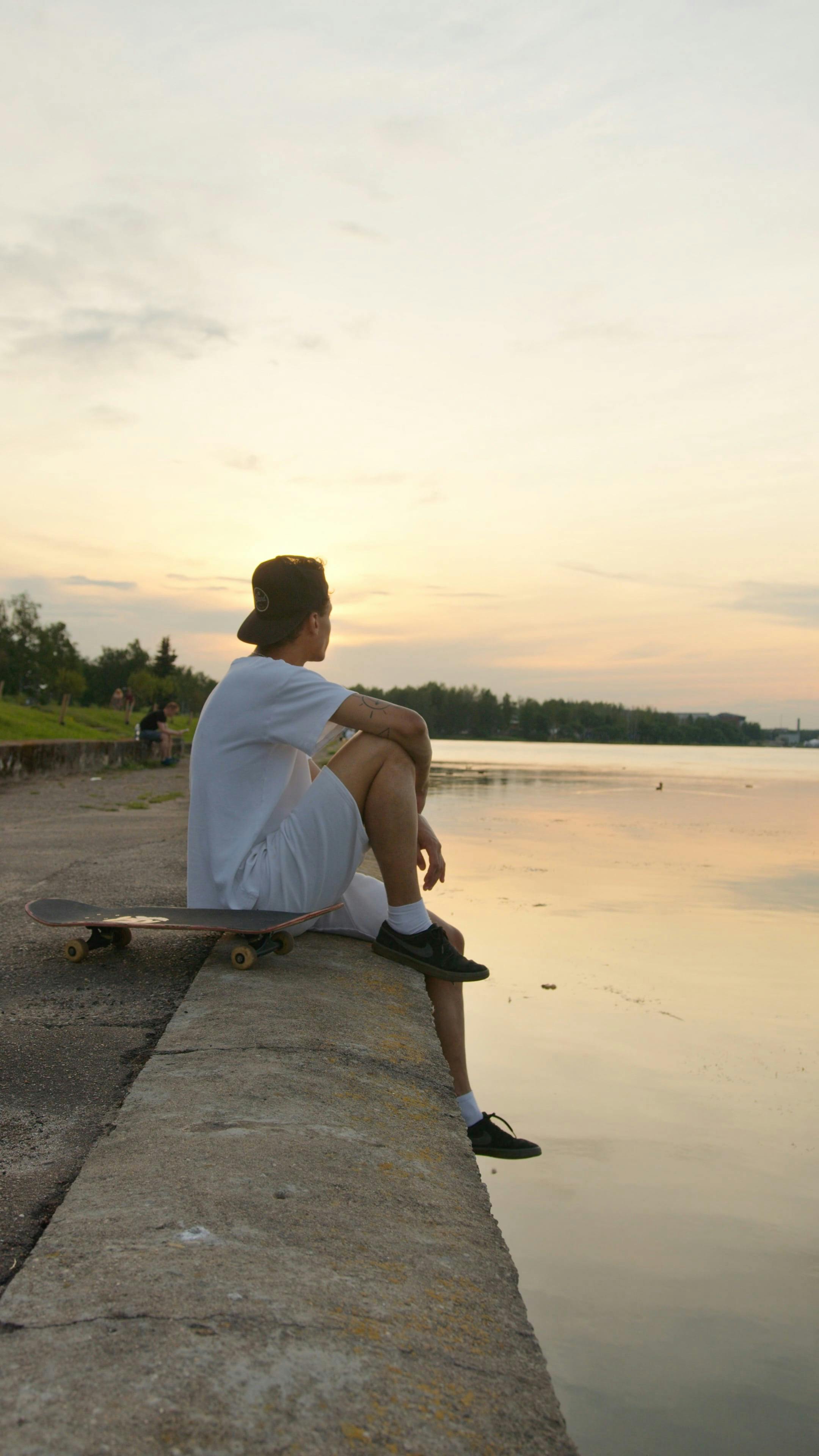 A Young Man Enjoying The Nature View By The Lake · Free Stock Video