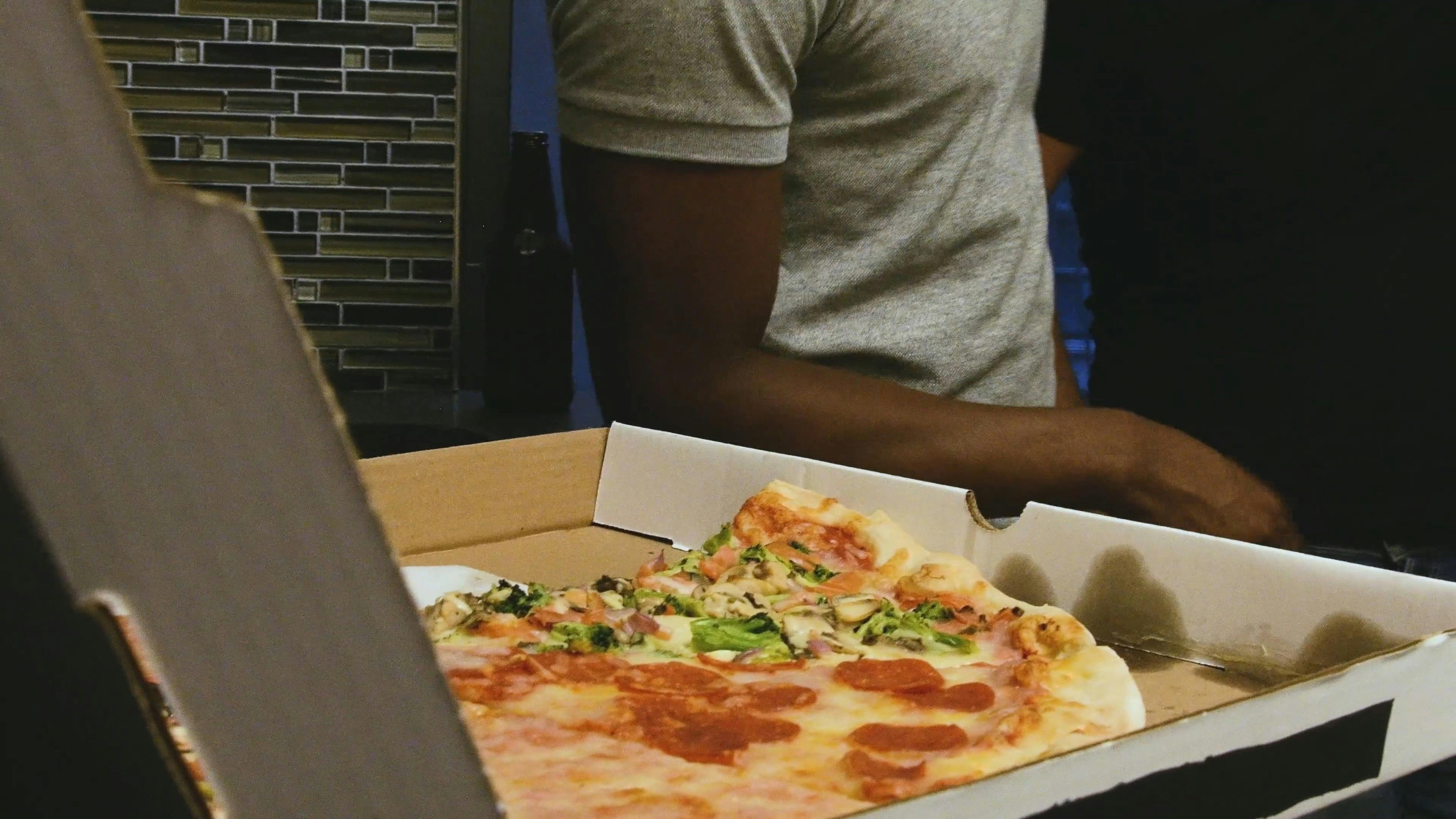 A Man Grabbing A Slice of Pizza Free Stock Video Footage, Royalty-Free ...