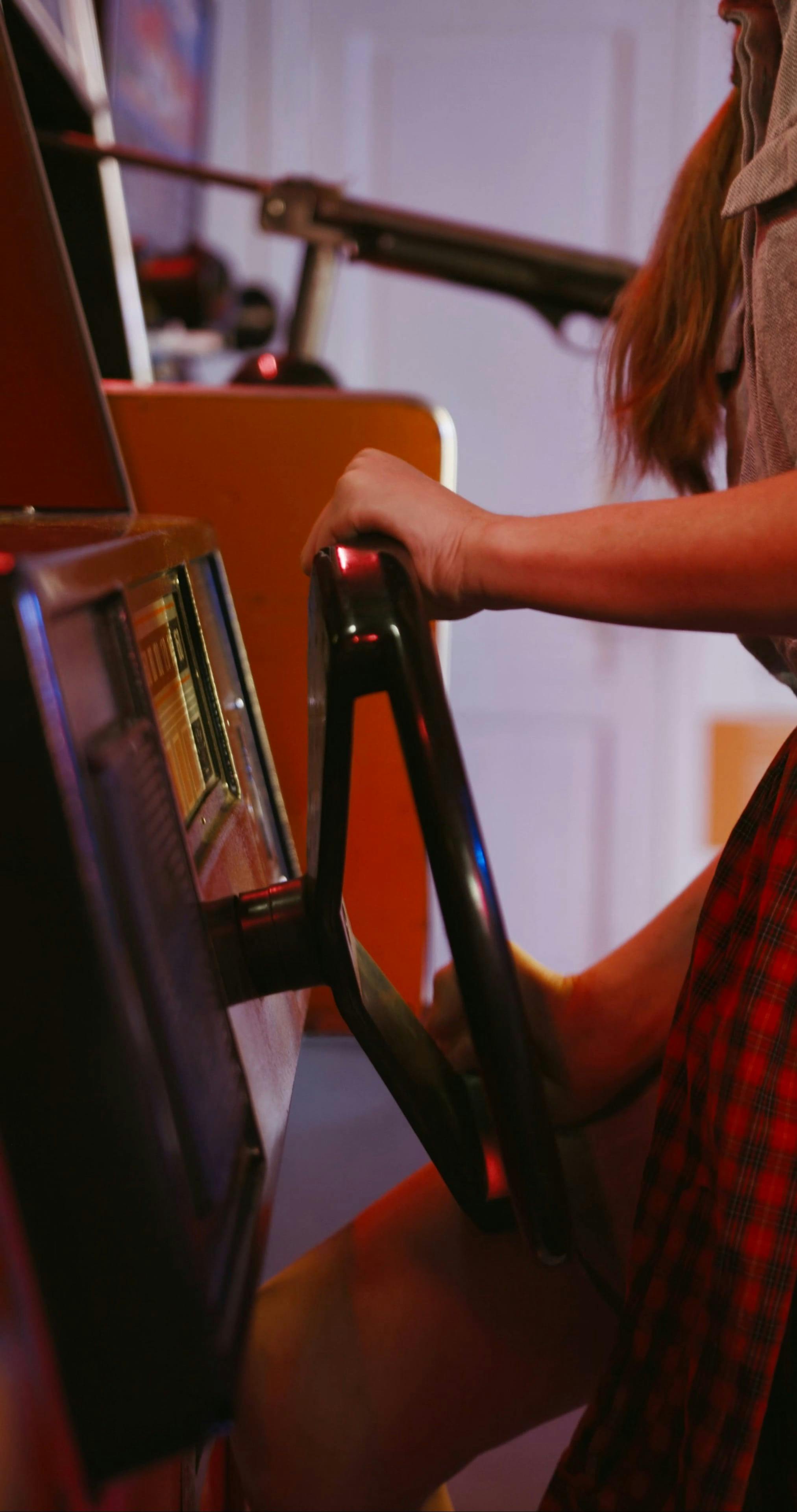A woman is sitting at a computer with headphones on Free Stock Video ...