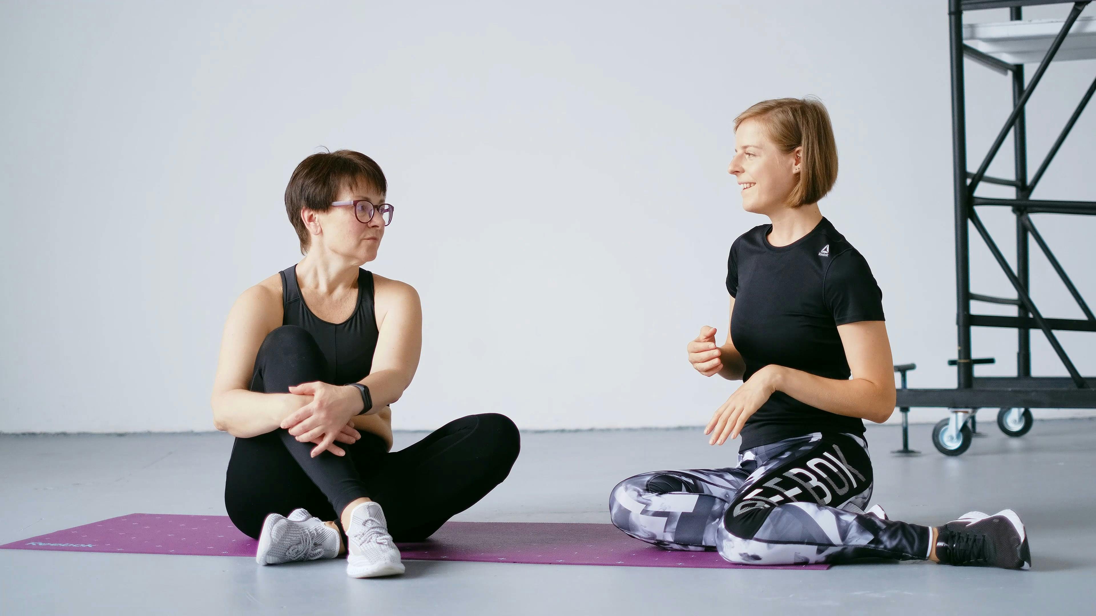 Trainer Explaining an Exercise to a Woman Free Stock Video Footage ...