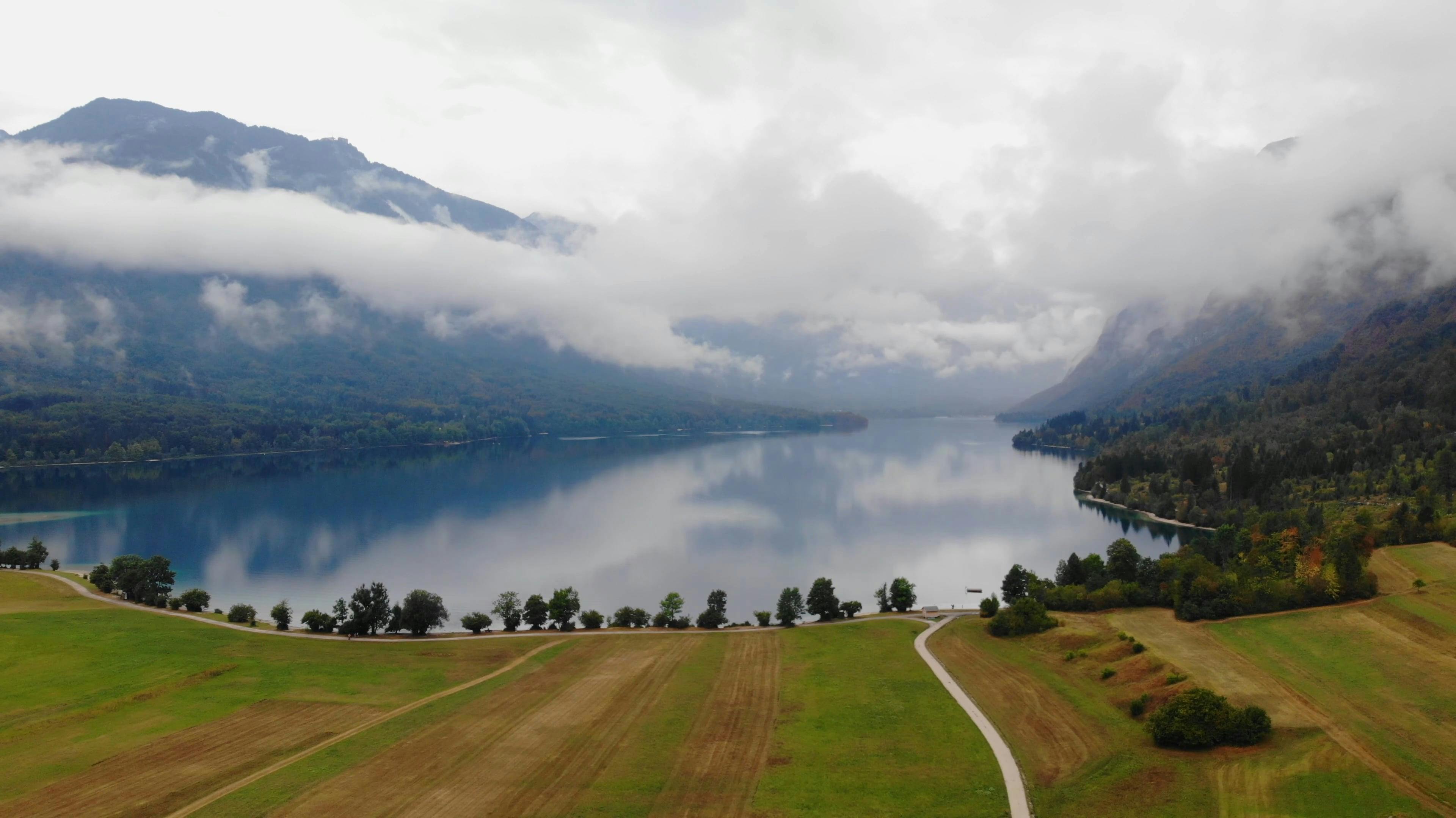 Distorted Reflections Of A Lake Surrounding On Its Water Surface Free ...