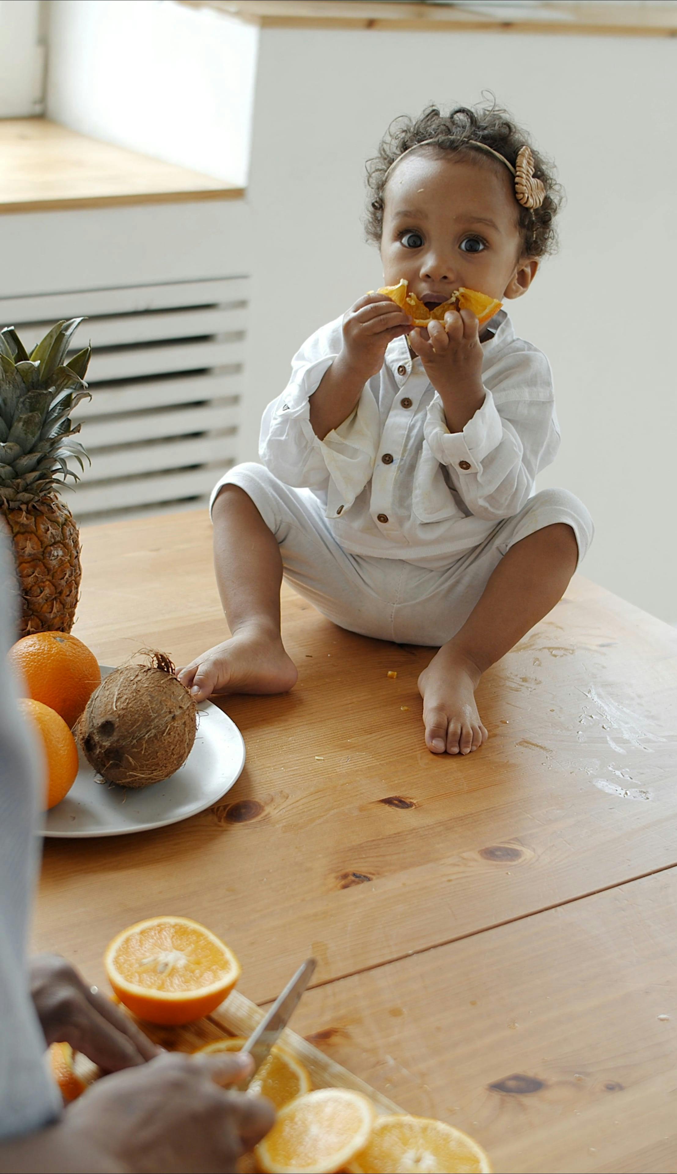 A Child Eating an Orange · Free Stock Video
