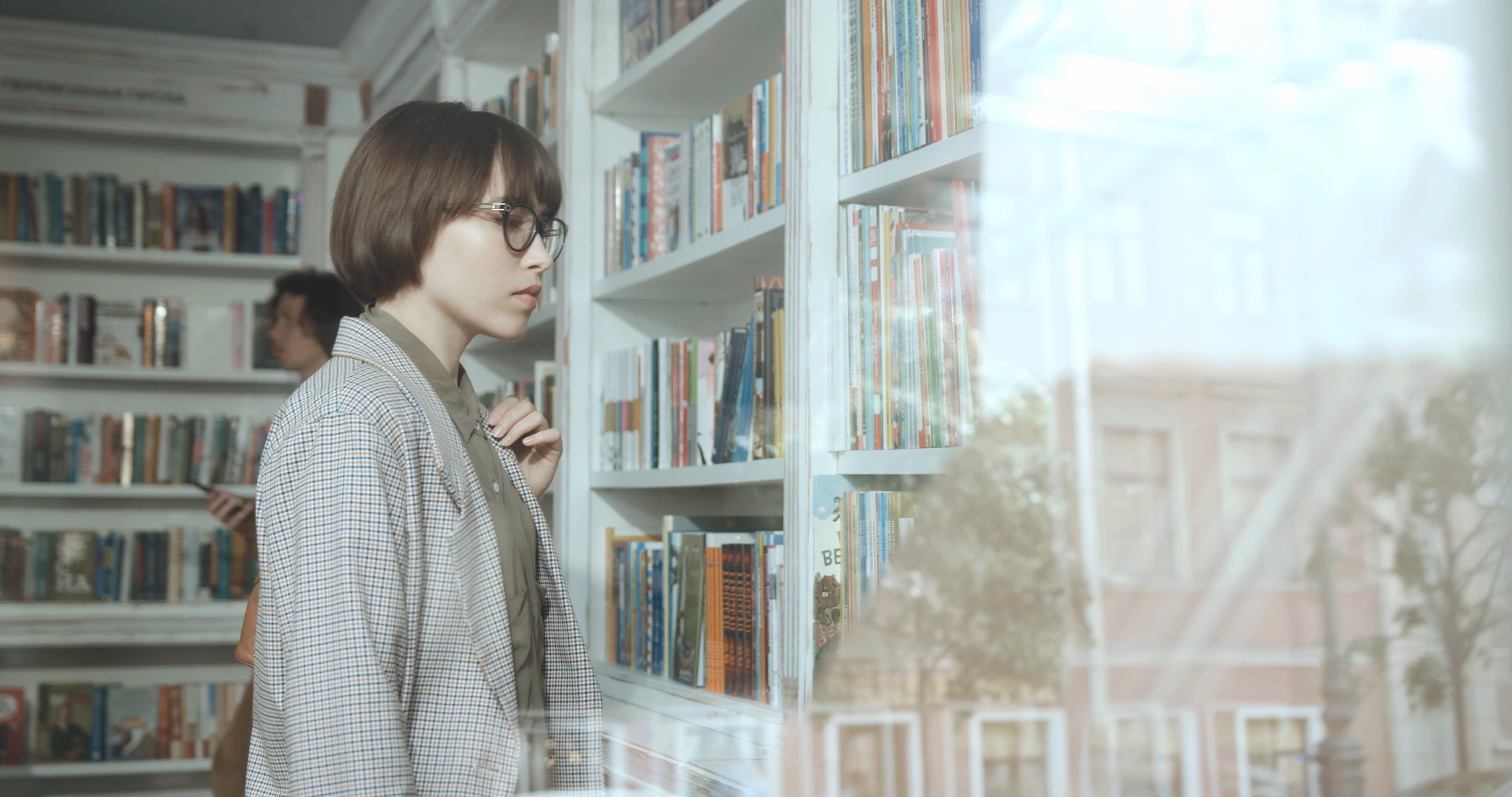 Person Placing Book on Shelf · Free Stock Video
