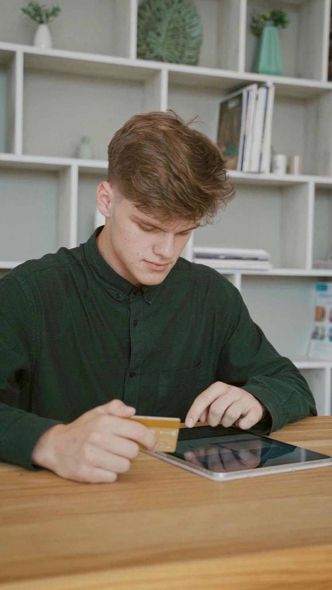 Man in Dark Green Long Sleeves Using His Ipad Pro · Free Stock Video